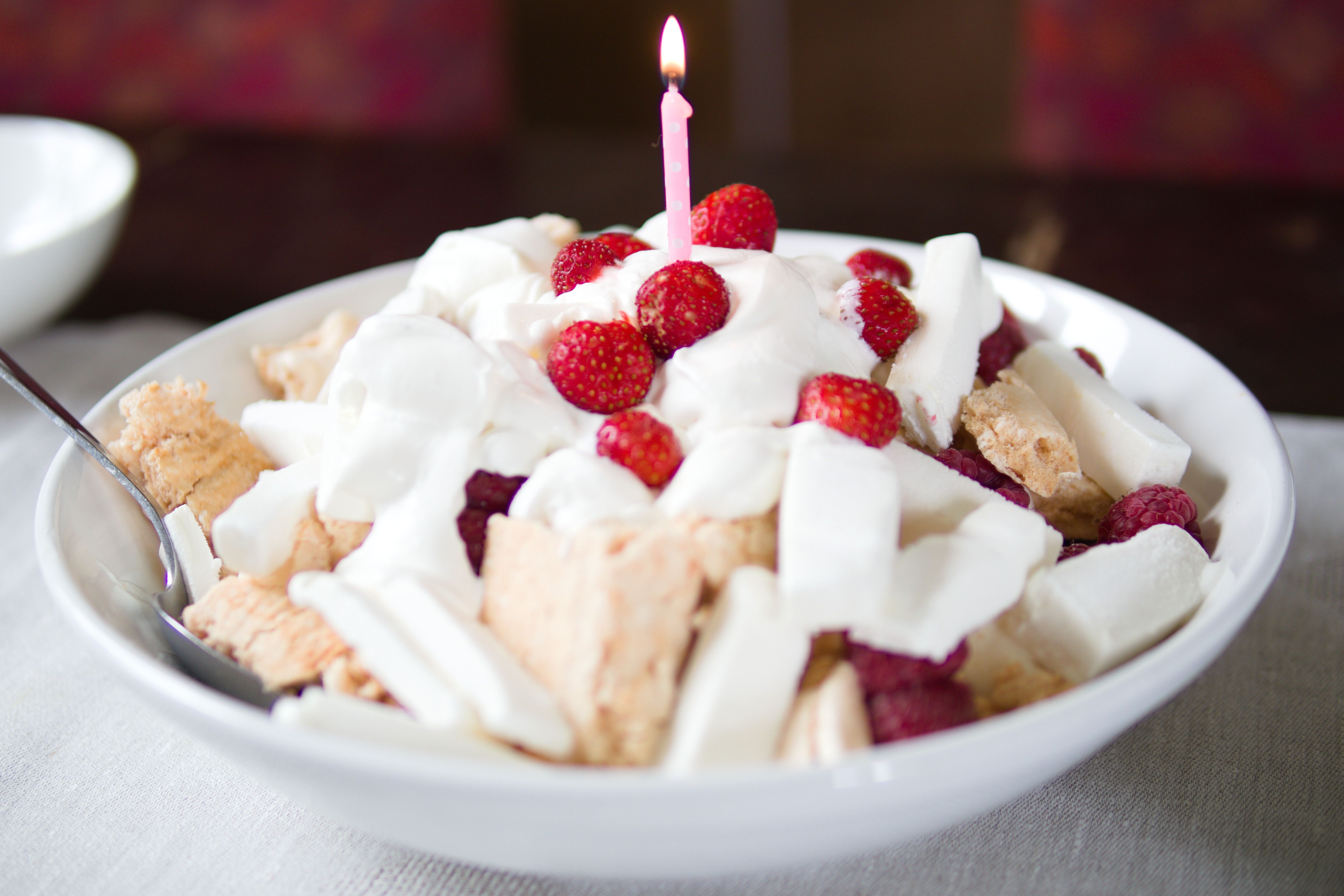 A White Ceramic Bowl With Strawberries and Cream · Free Stock Photo