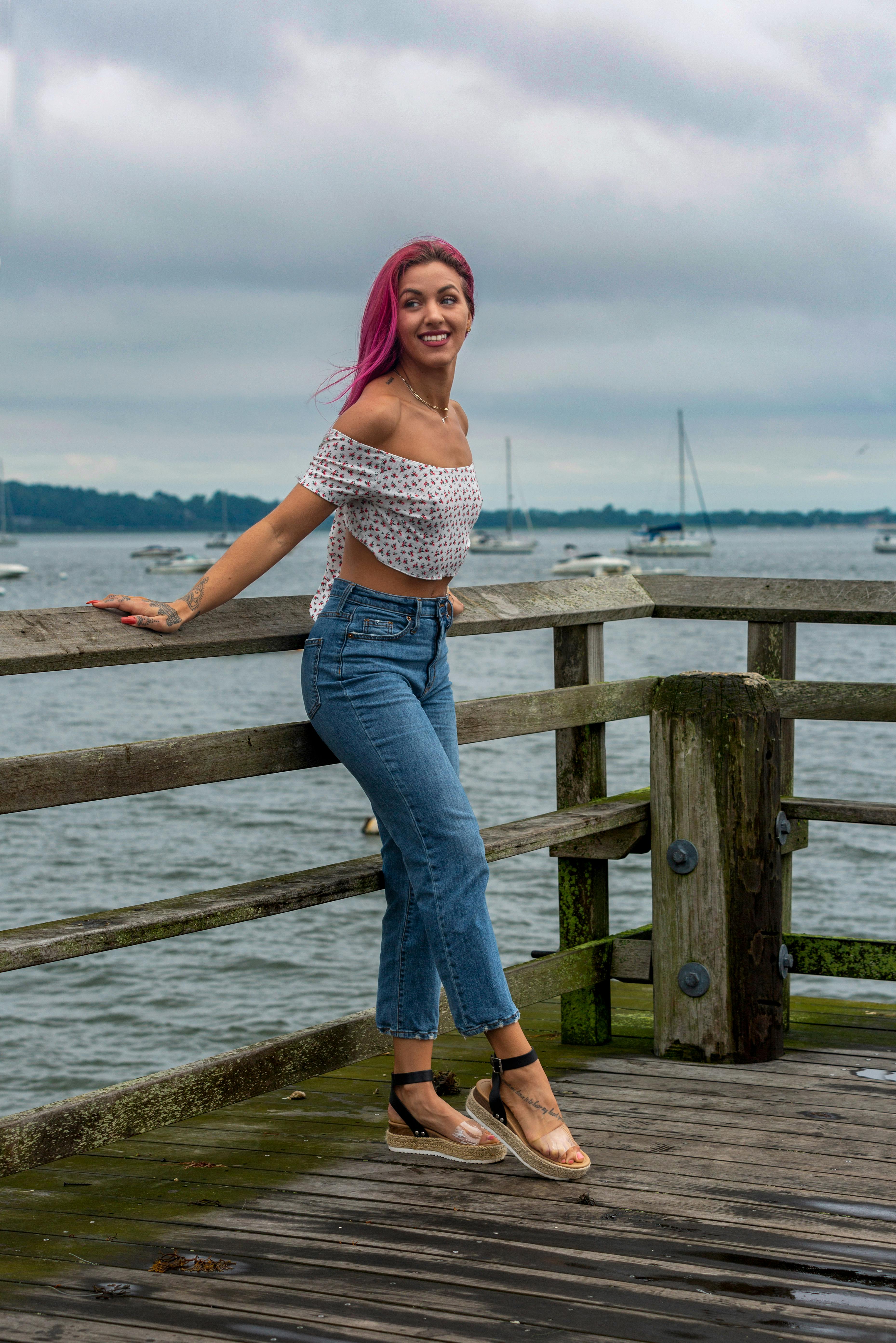 Leaning on Railing Woman Looking at Sea · Free Stock Photo