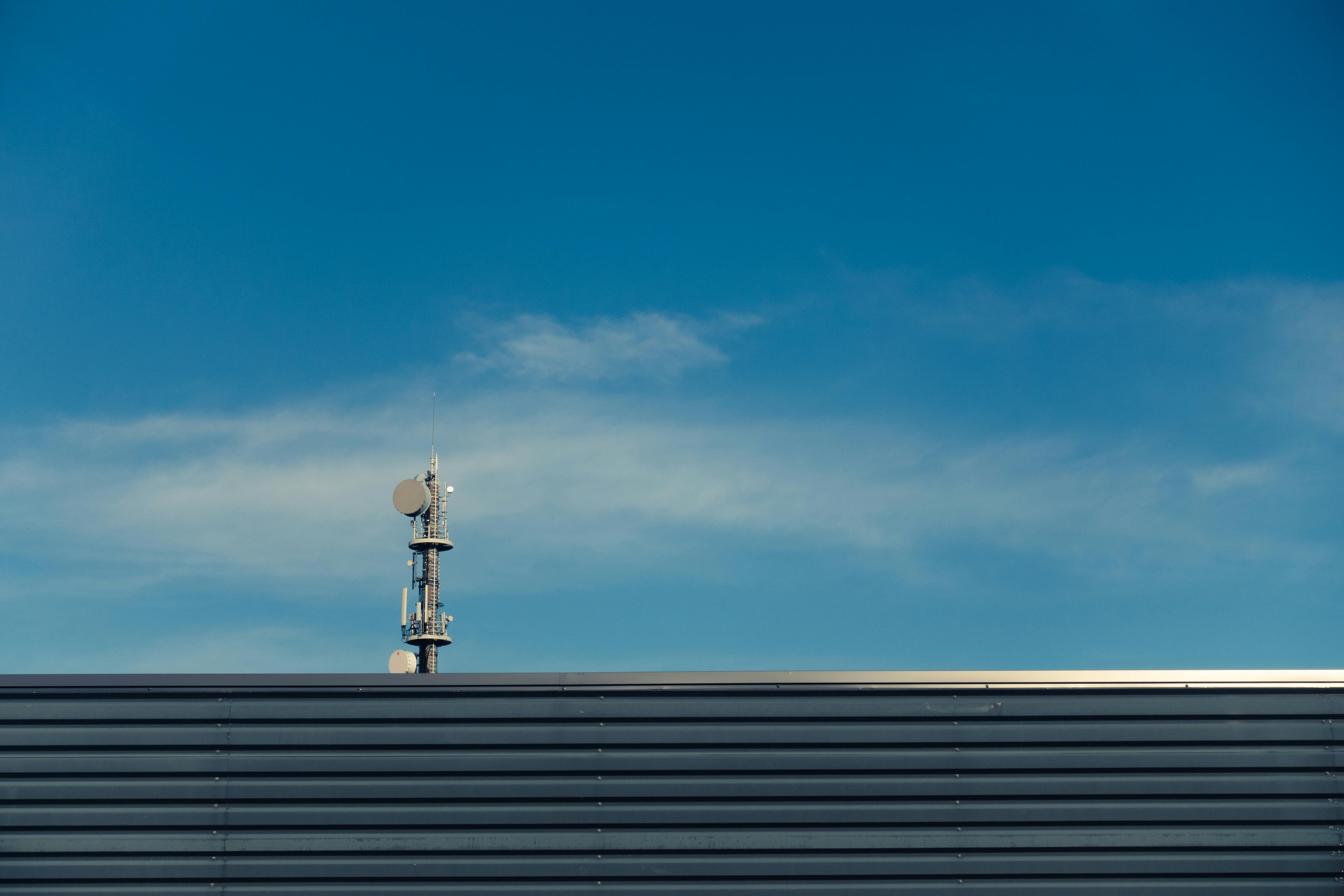 Communication Tower with Transmitters · Free Stock Photo