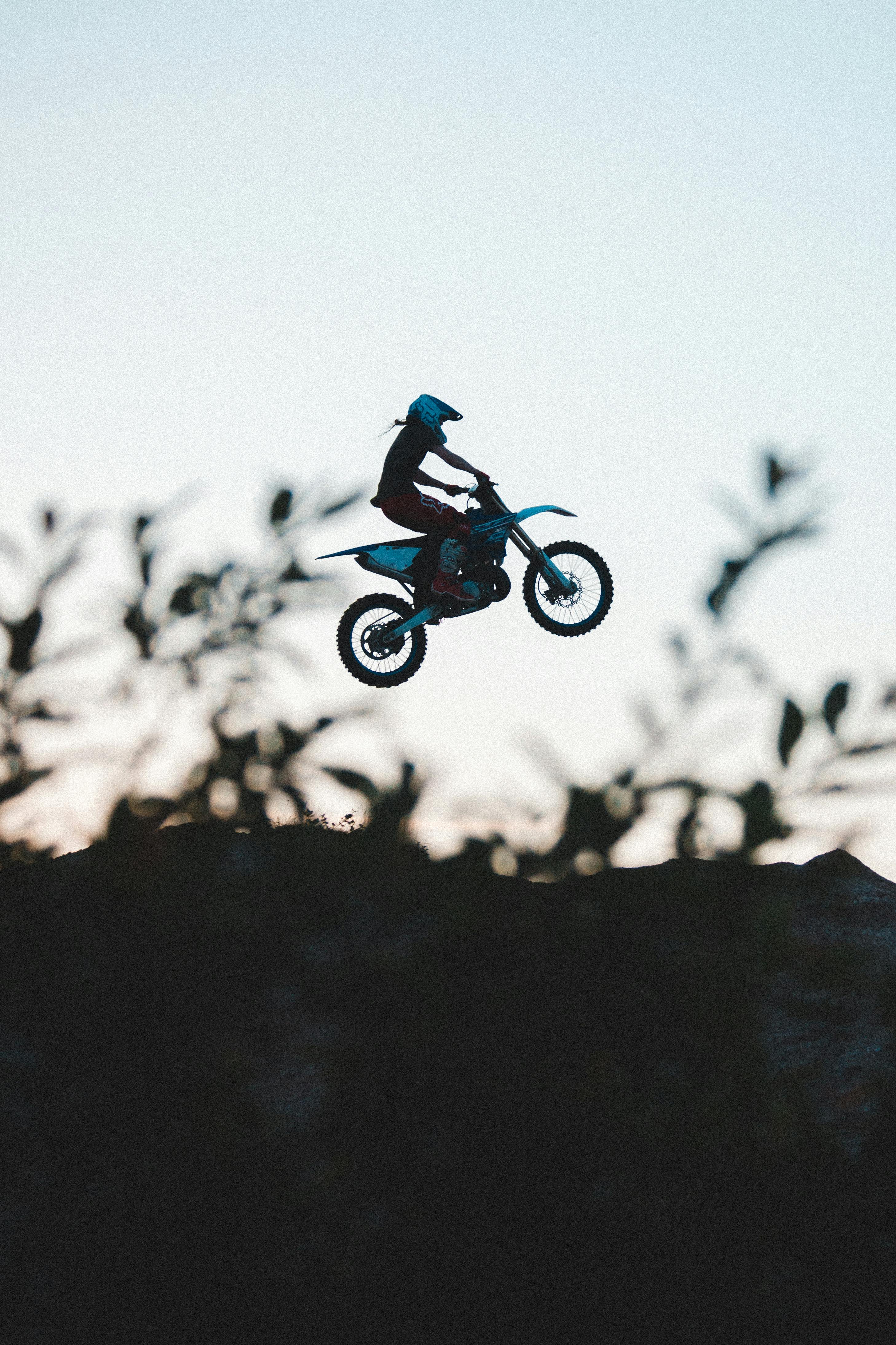 A Man Riding a Motorcycle on Mid Air · Free Stock Photo