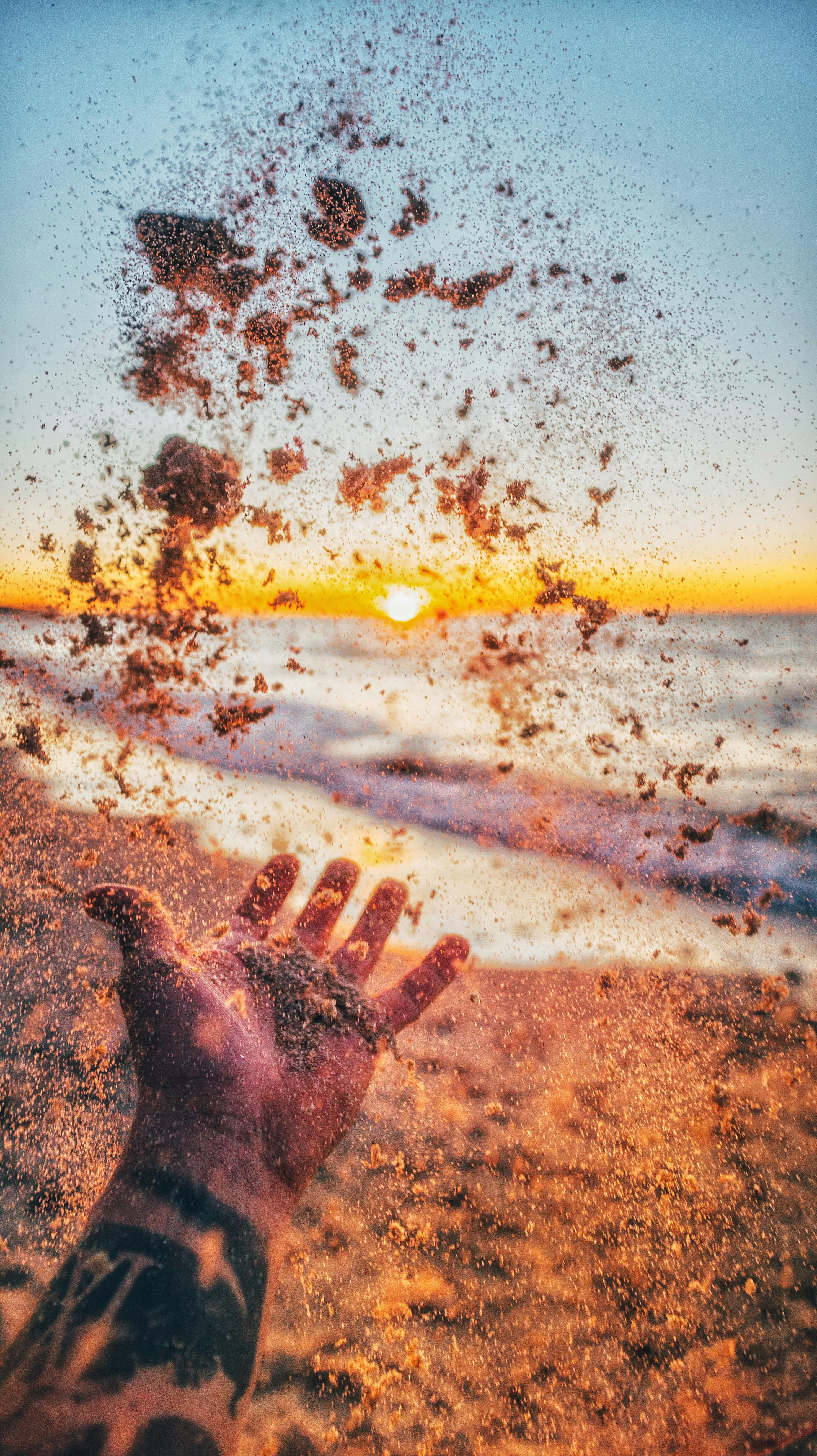 Woman Spilling Sand through Hands · Free Stock Photo