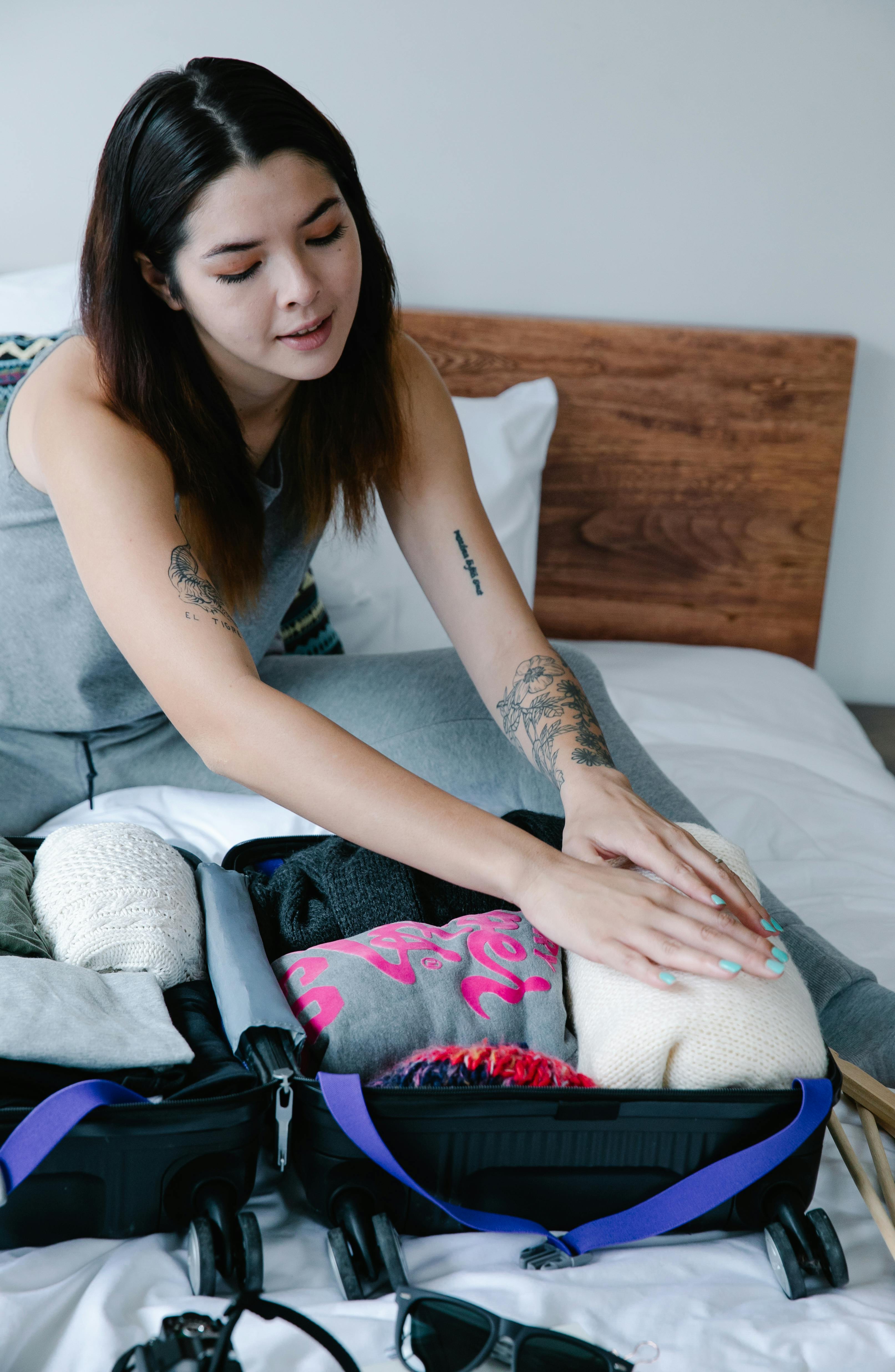 A Woman Packing Up Her Things · Free Stock Photo