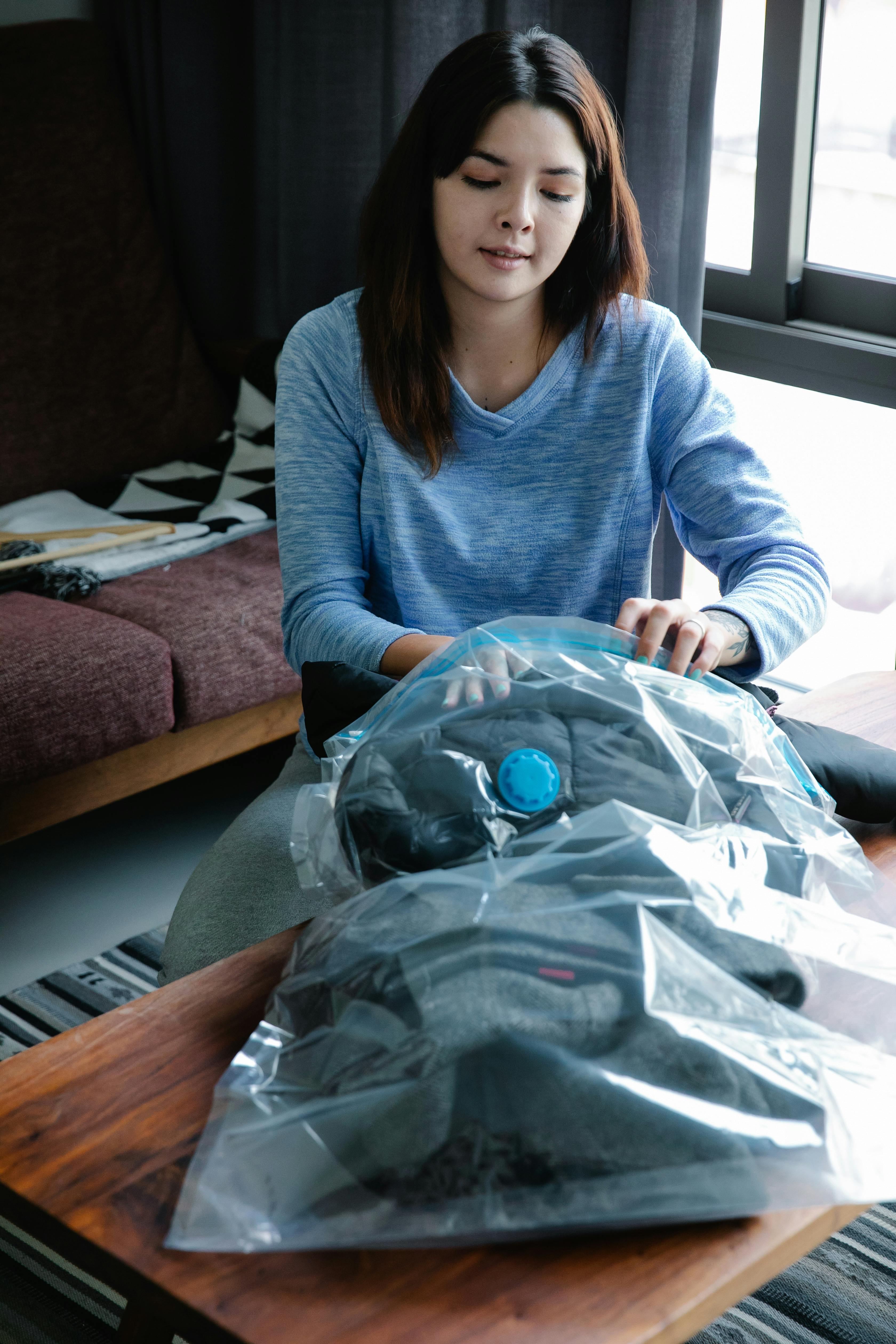 A Woman Packing Up Her Things · Free Stock Photo