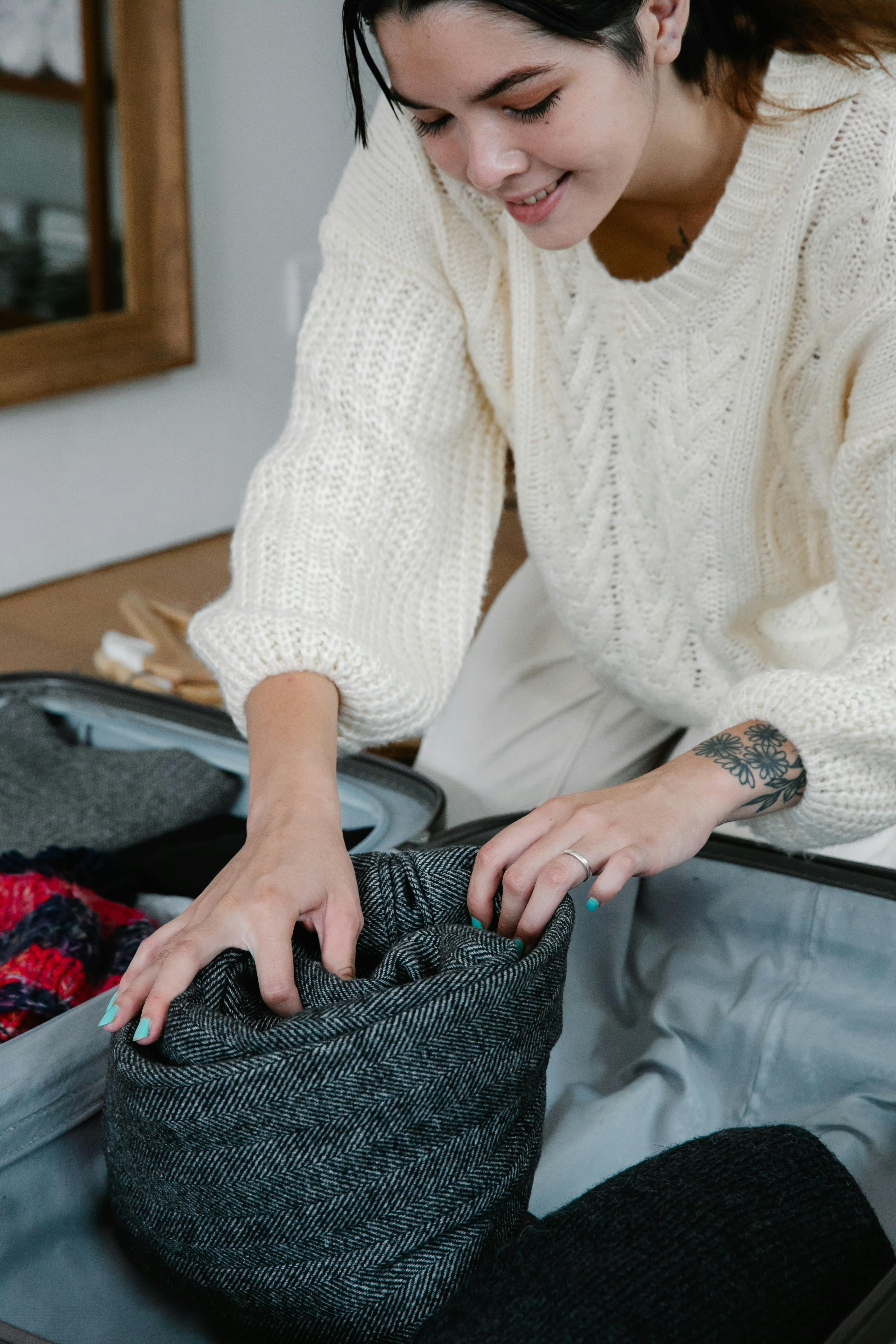A Woman Packing Up Her Things · Free Stock Photo