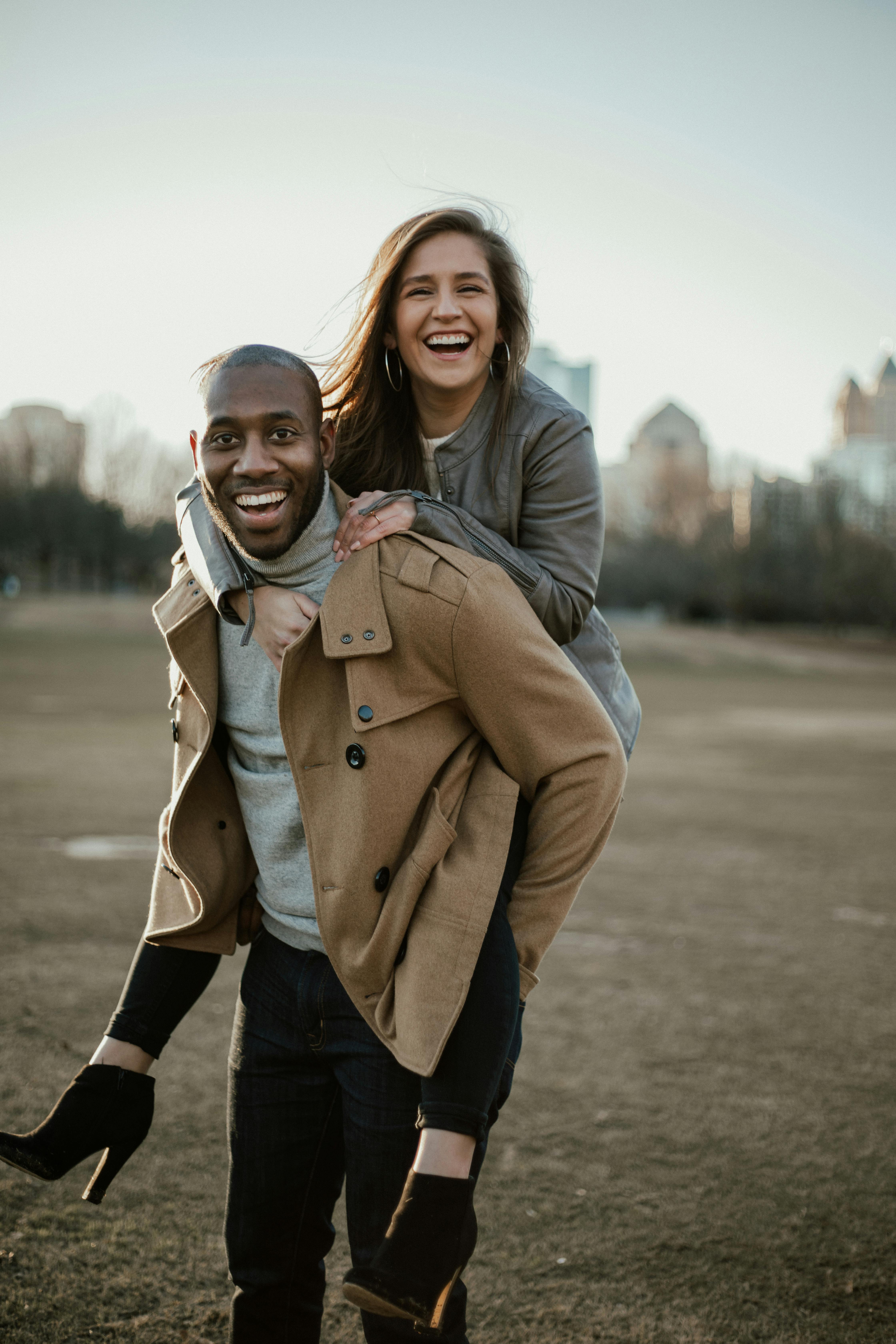 Happy Man carrying his Partner · Free Stock Photo