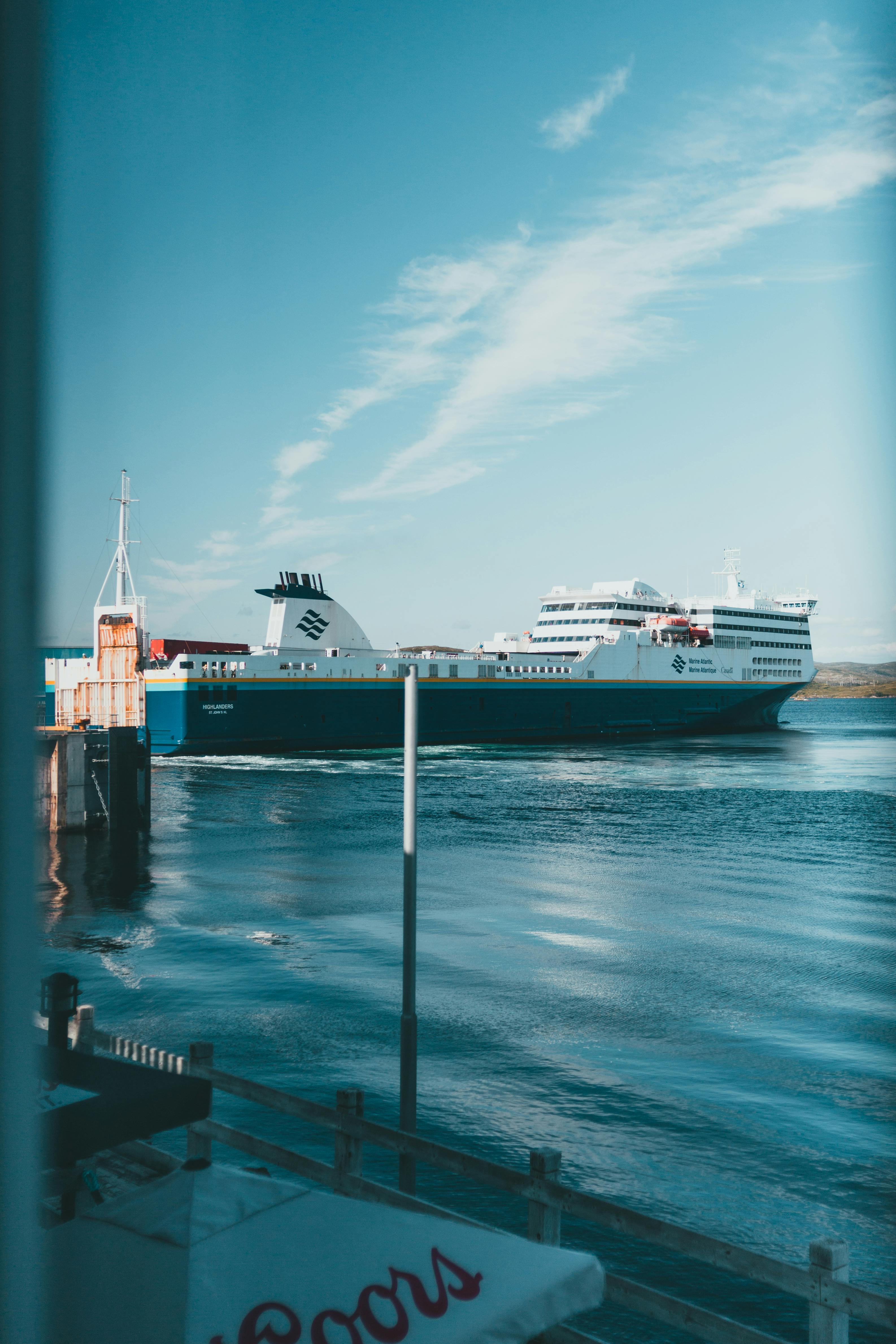 Top View of a Woman Leaning Overboard on a Ship · Free Stock Photo