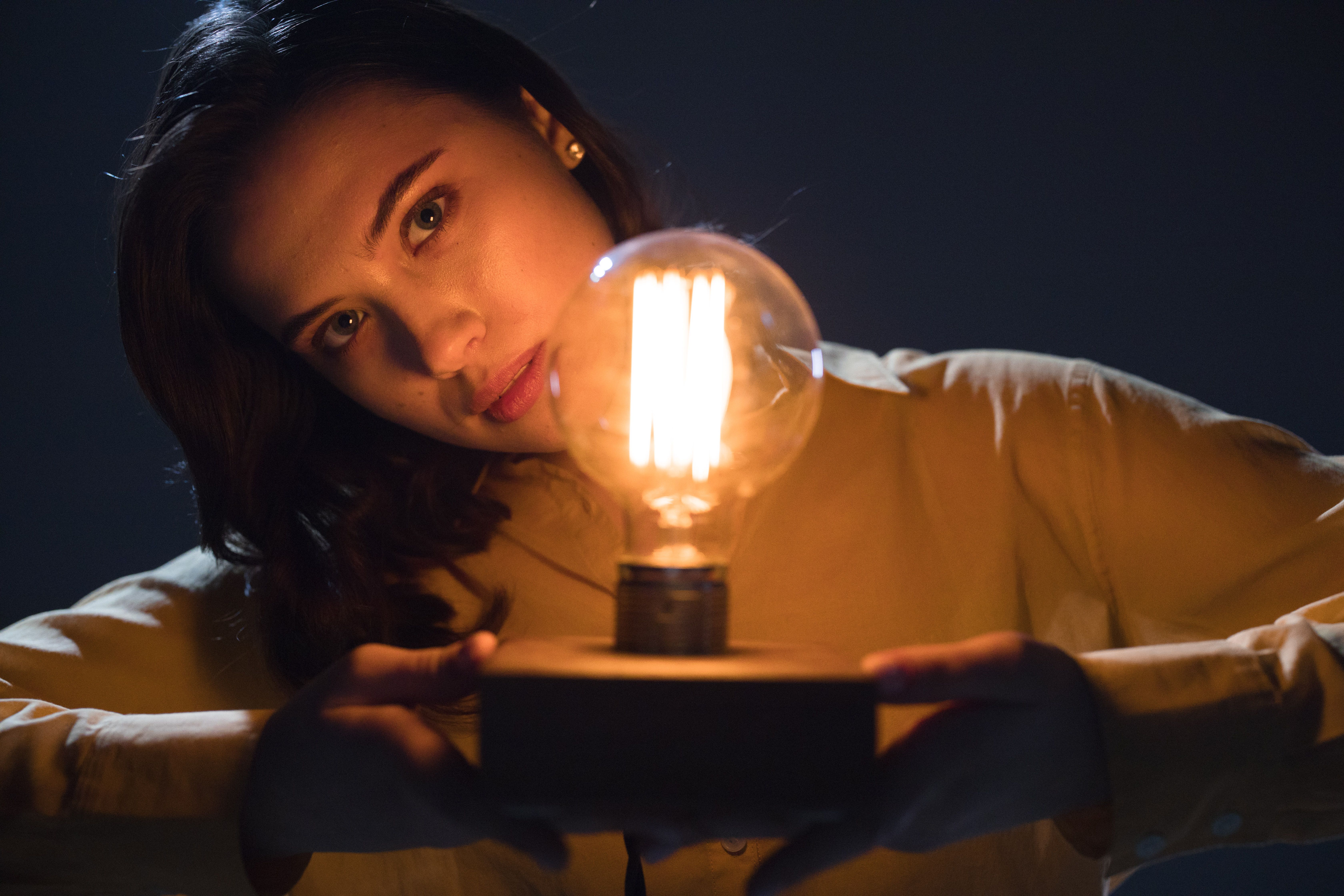 Woman Holding a Light · Free Stock Photo