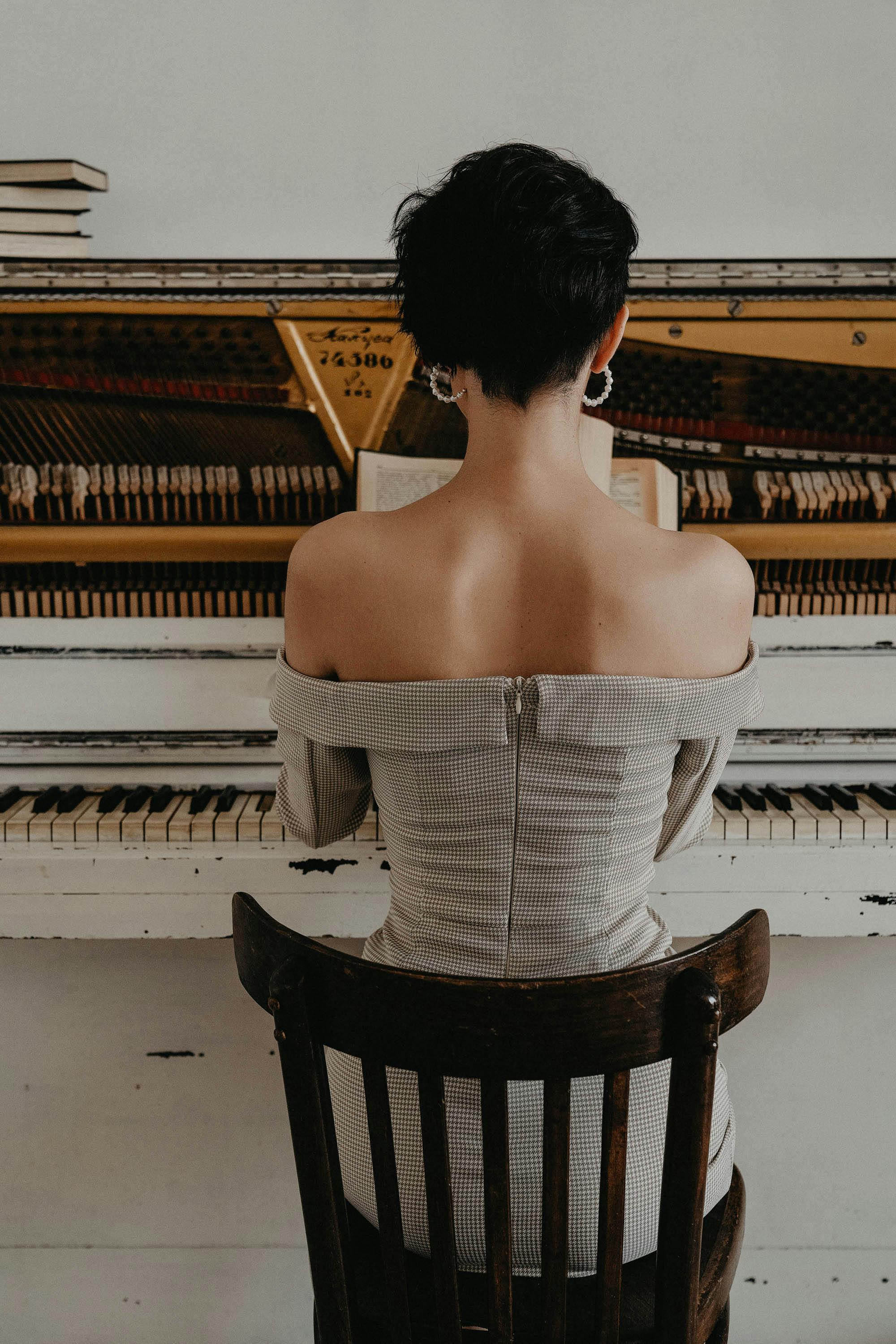 An Elegant Woman Playing Piano · Free Stock Photo