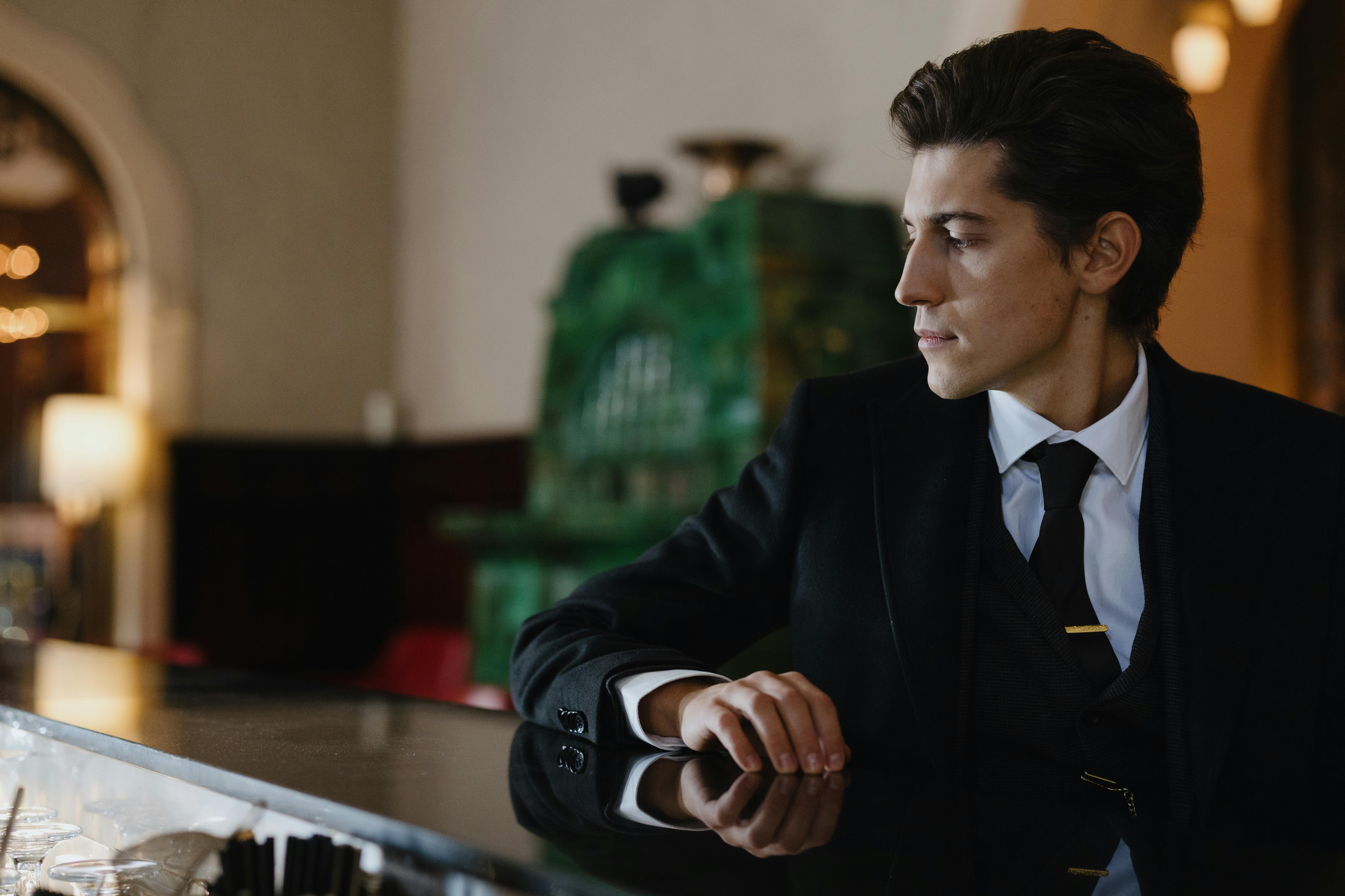 Profile of Man in Black Suit · Free Stock Photo