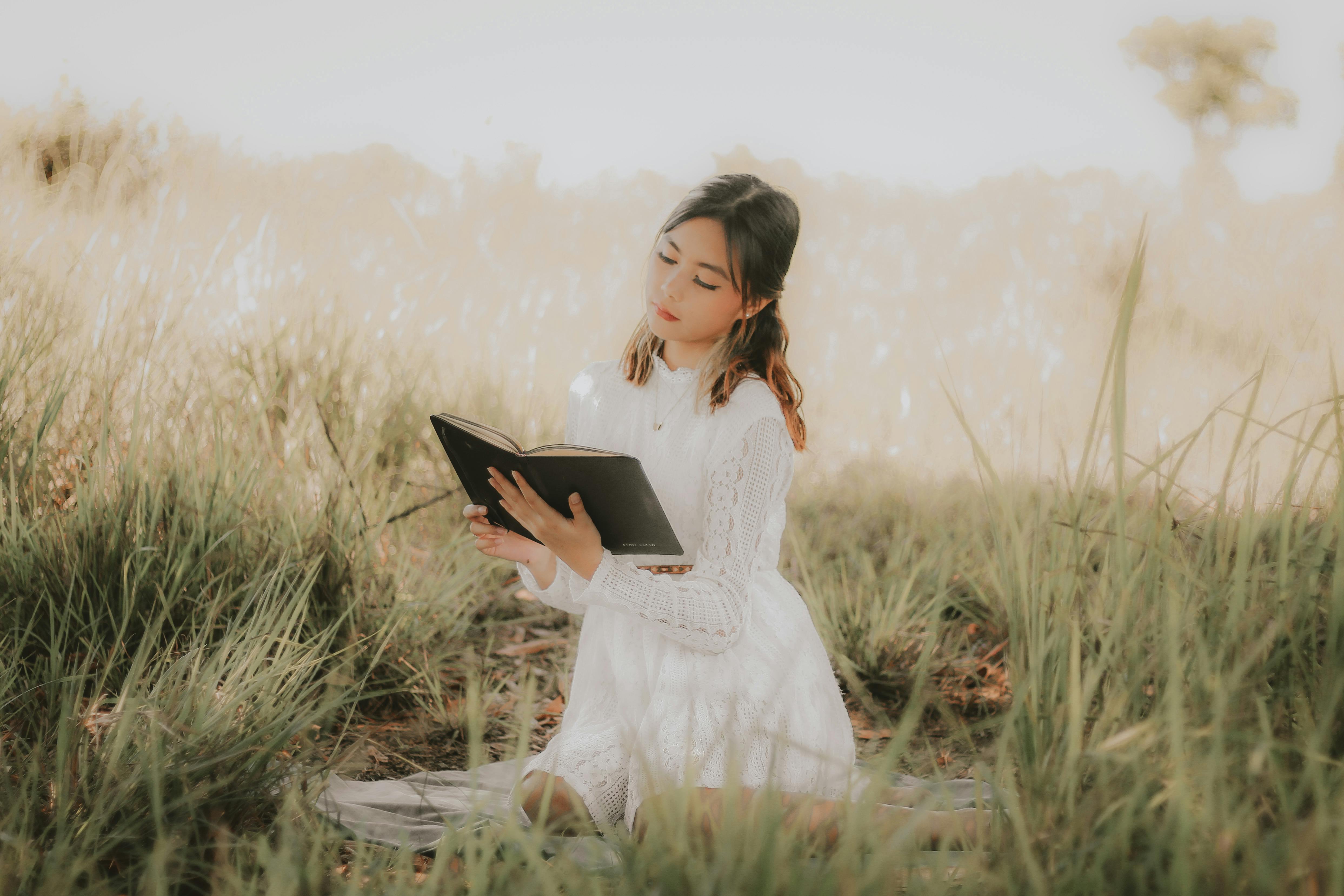 Beautiful Woman in White Dress Reading a Book · Free Stock Photo
