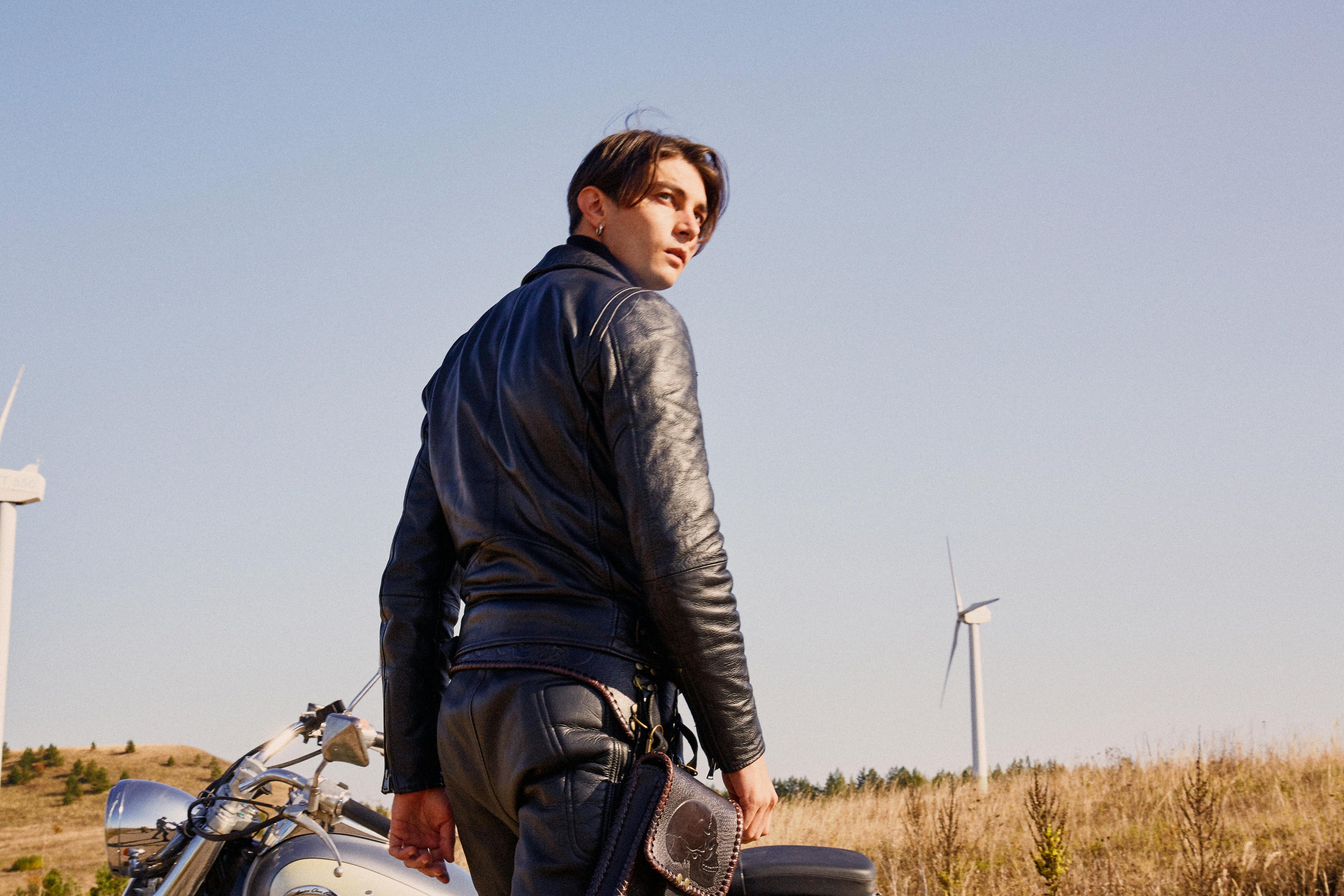 Man in Black Leather Jacket Looking Back · Free Stock Photo