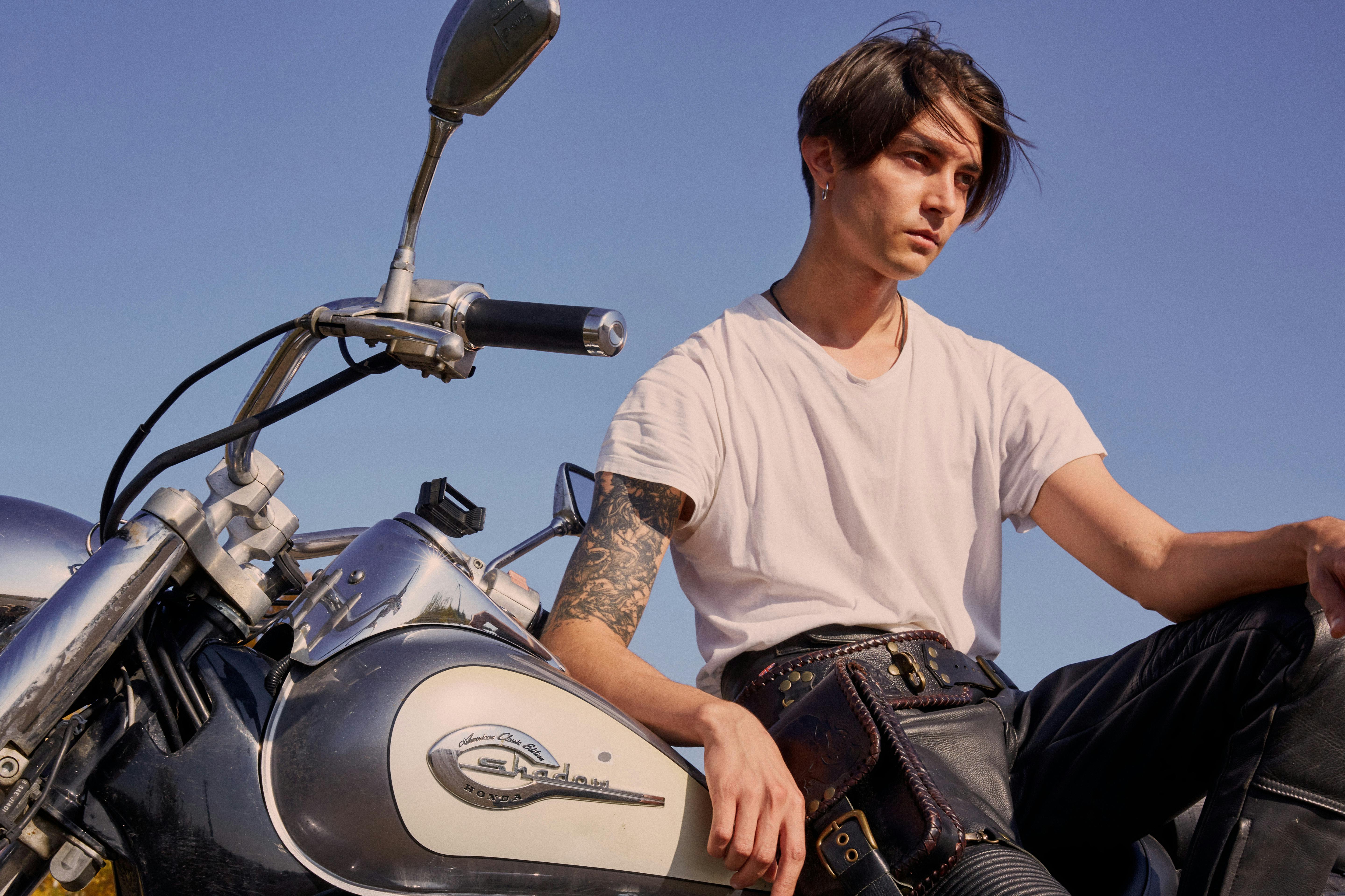 Person in White Shirt Sitting on Motorcycle · Free Stock Photo