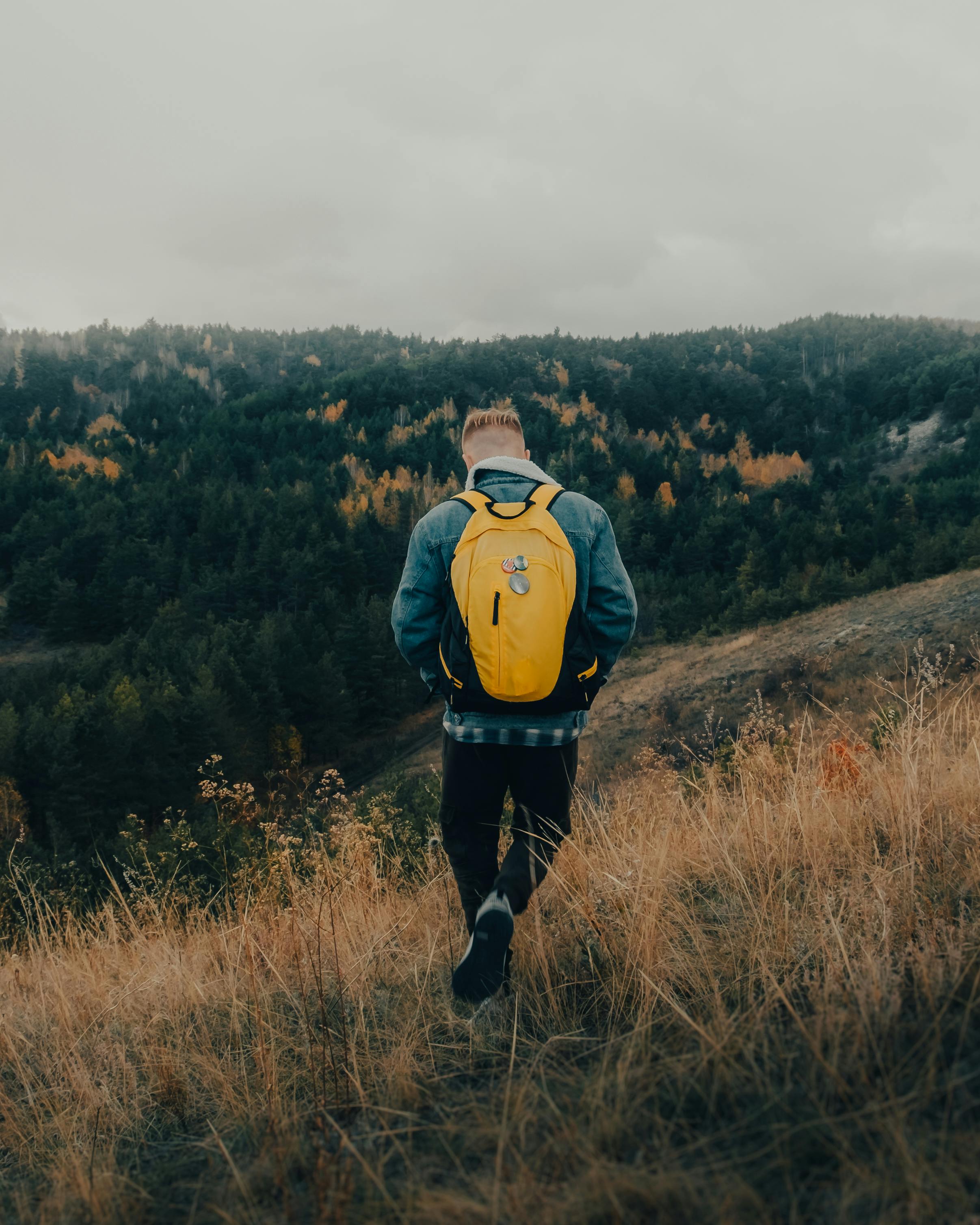 Full Shot of Man with Yellow Backpack · Free Stock Photo