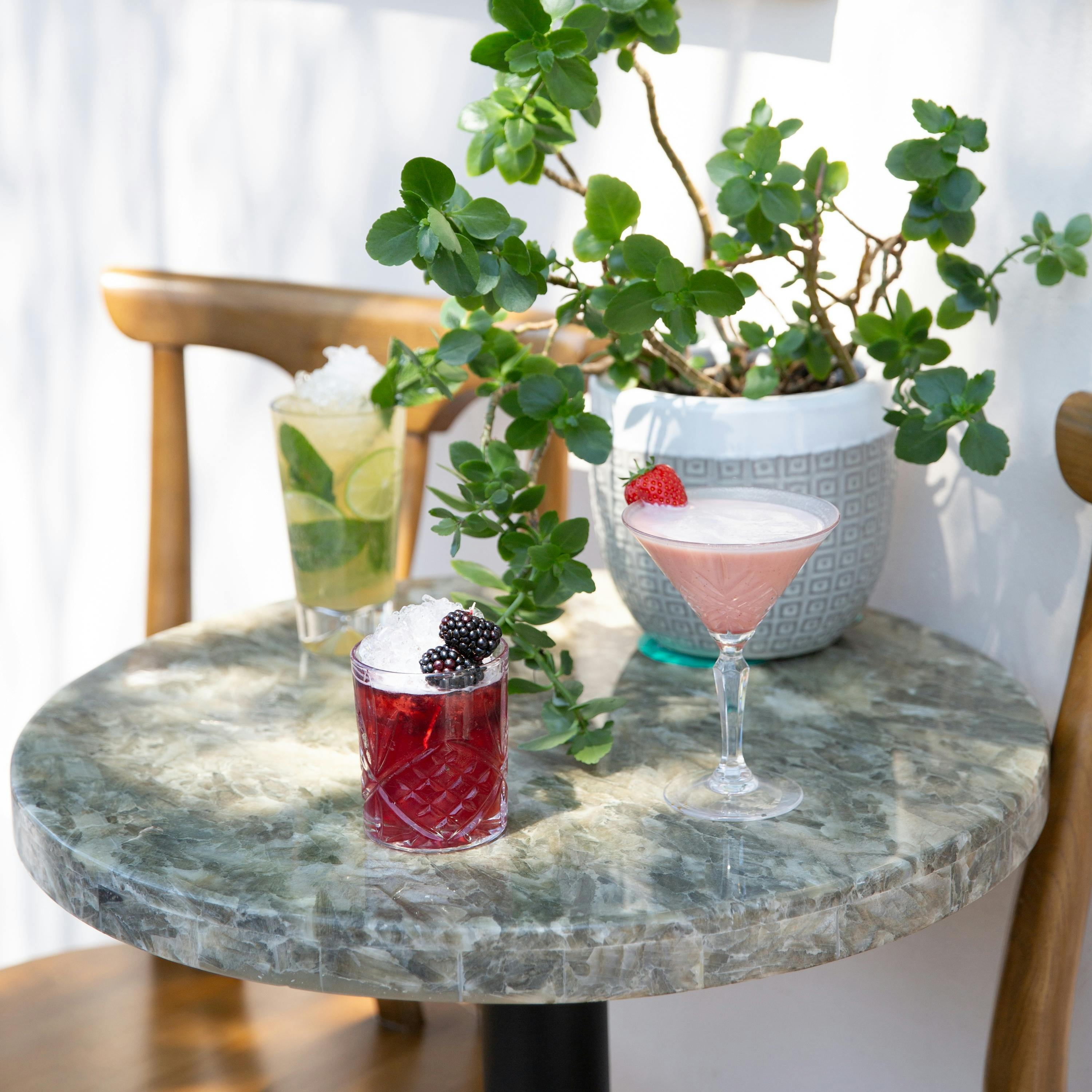 Cocktail Drinks on Round Tea Table · Free Stock Photo