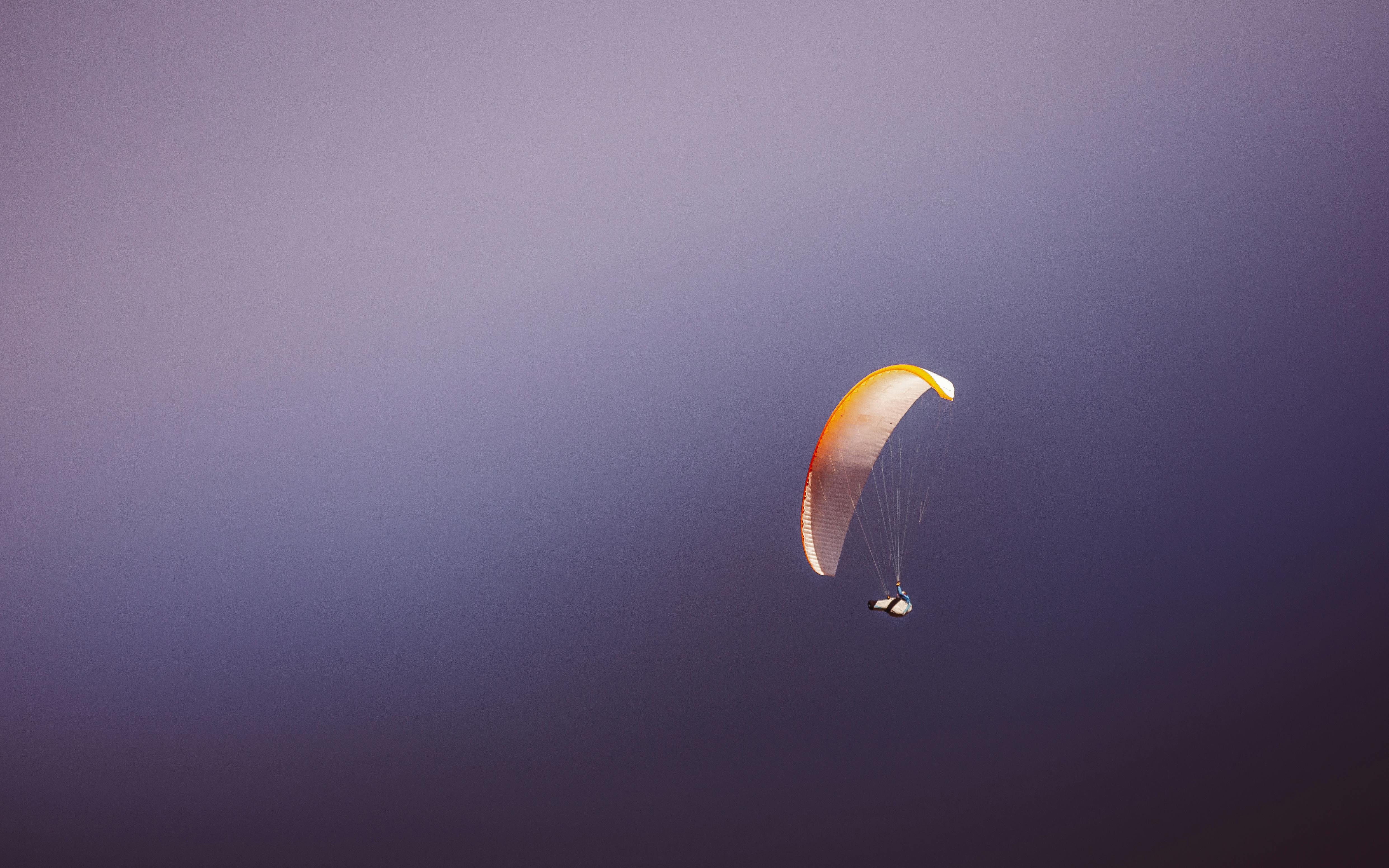 Person in Parachute under a Purple Sky · Free Stock Photo