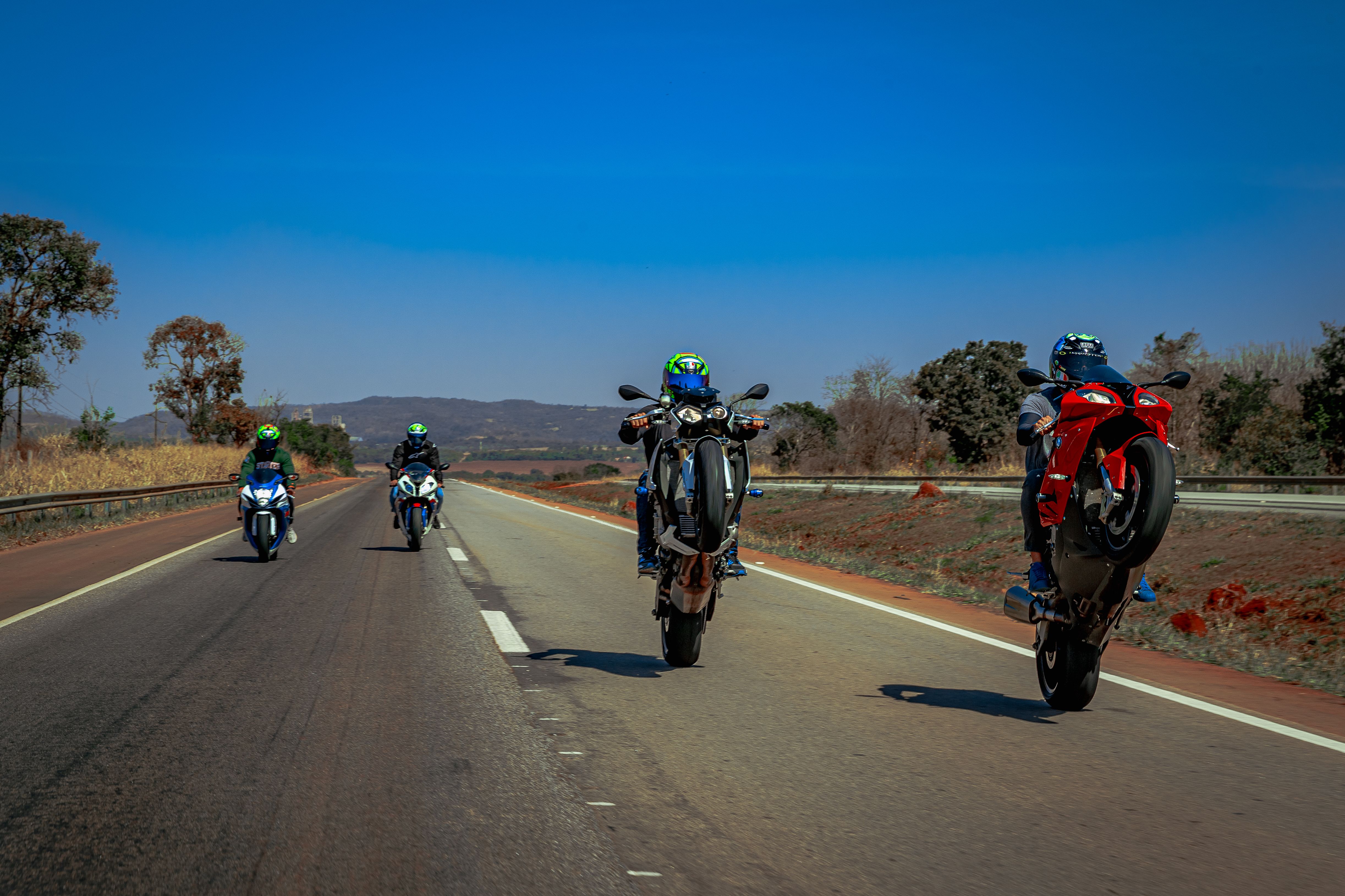 Person on a Motorcycle Doing a Wheelie · Free Stock Photo