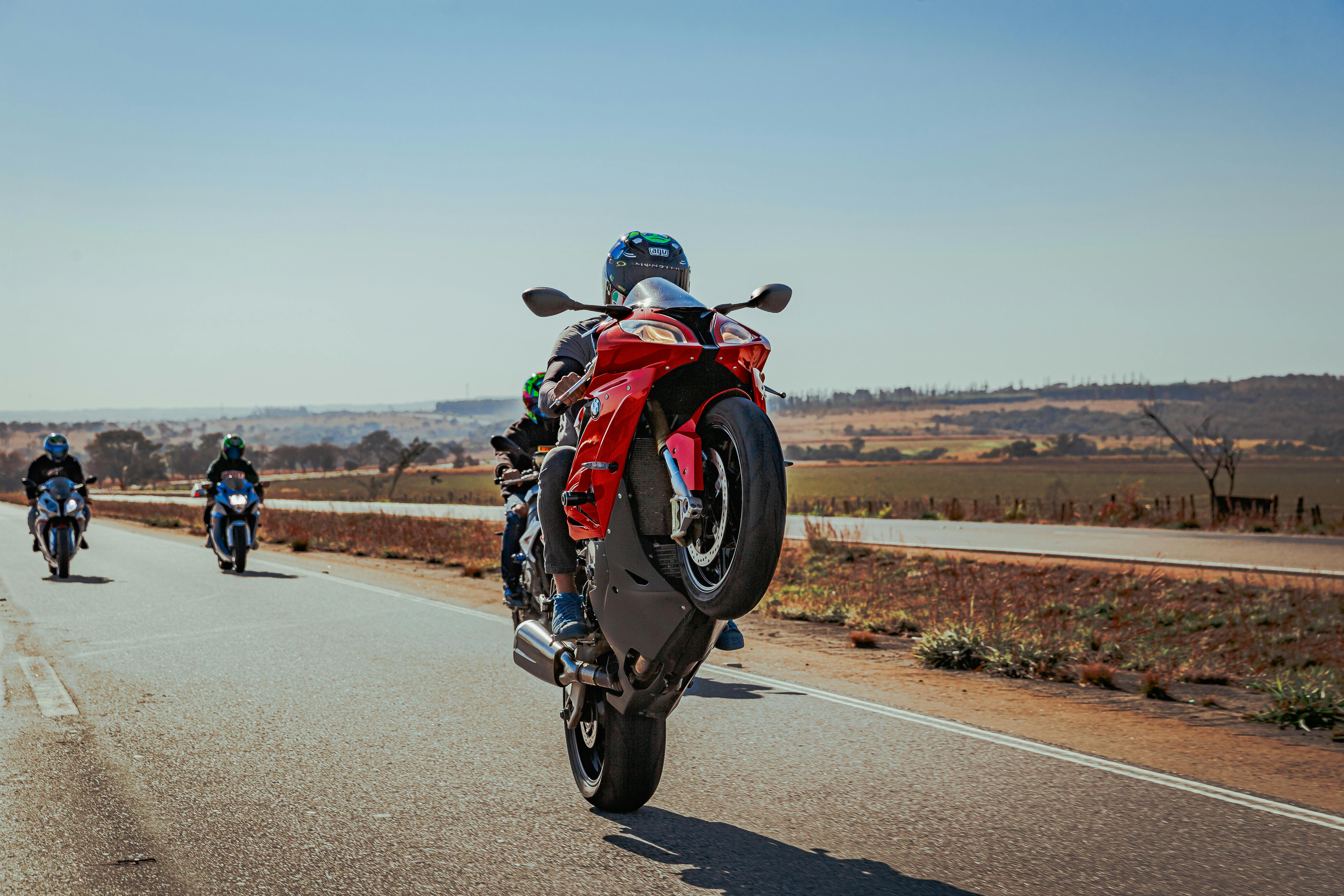 Man Riding a Red Motorcycle · Free Stock Photo