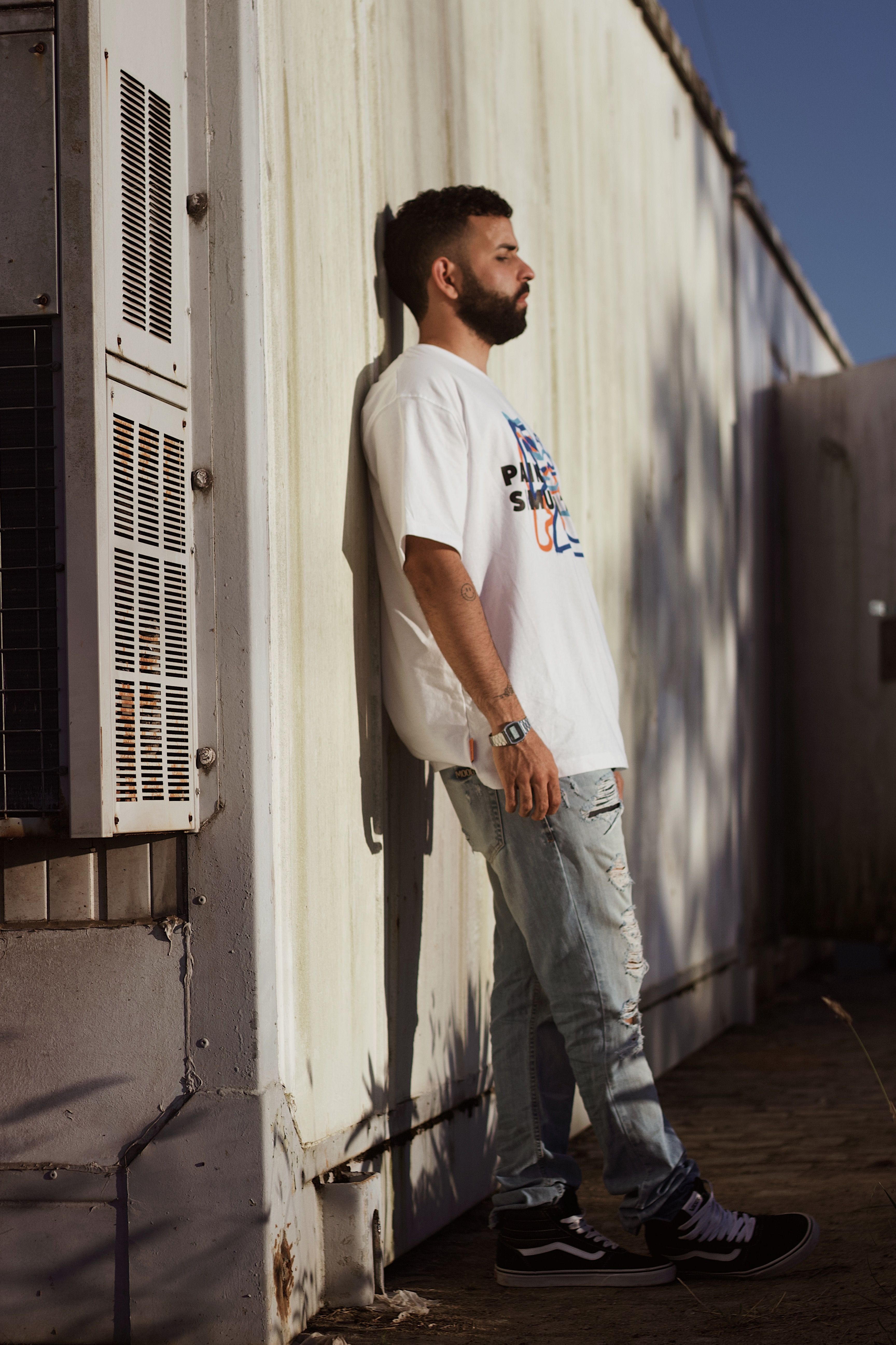 Low-Angle Shot of a Man in Streetwear Clothes · Free Stock Photo