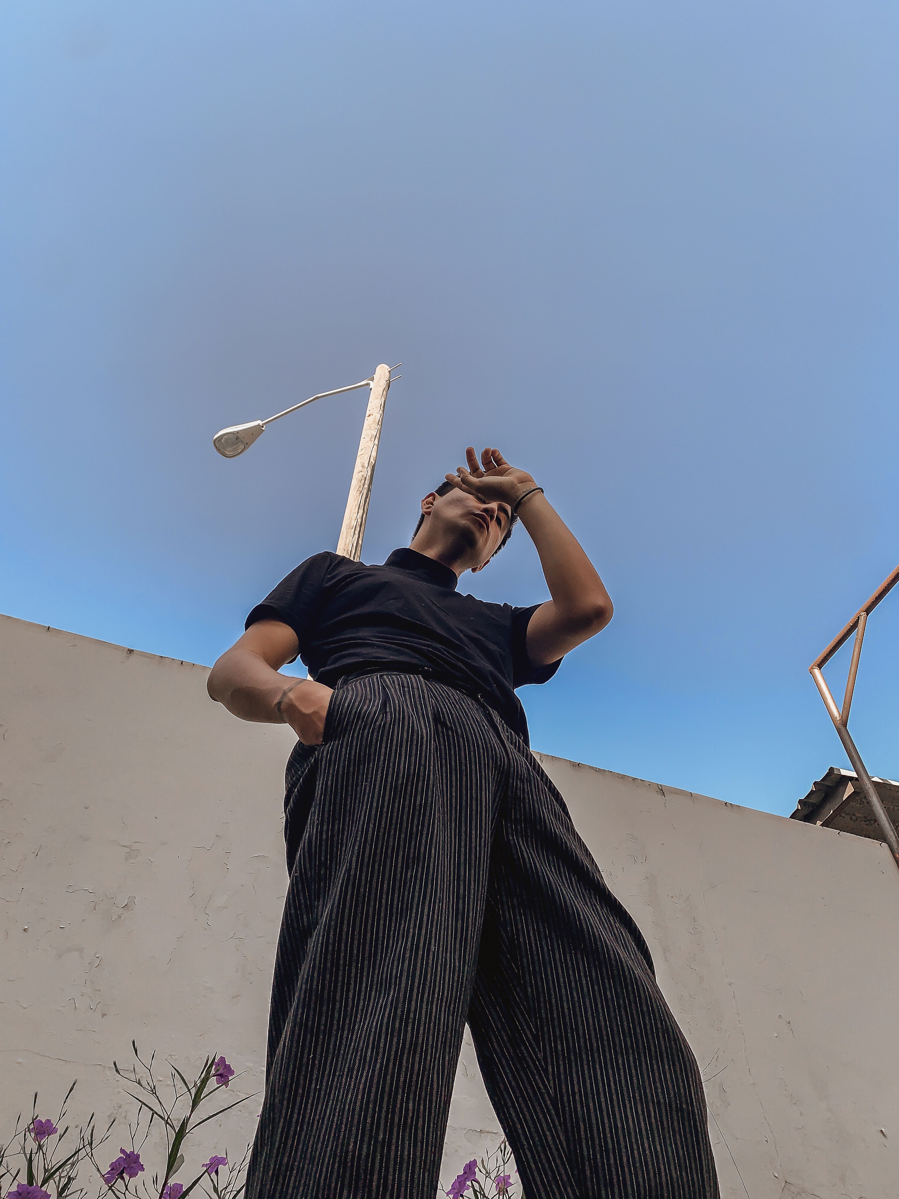 A Man Standing Under the Streetlight · Free Stock Photo