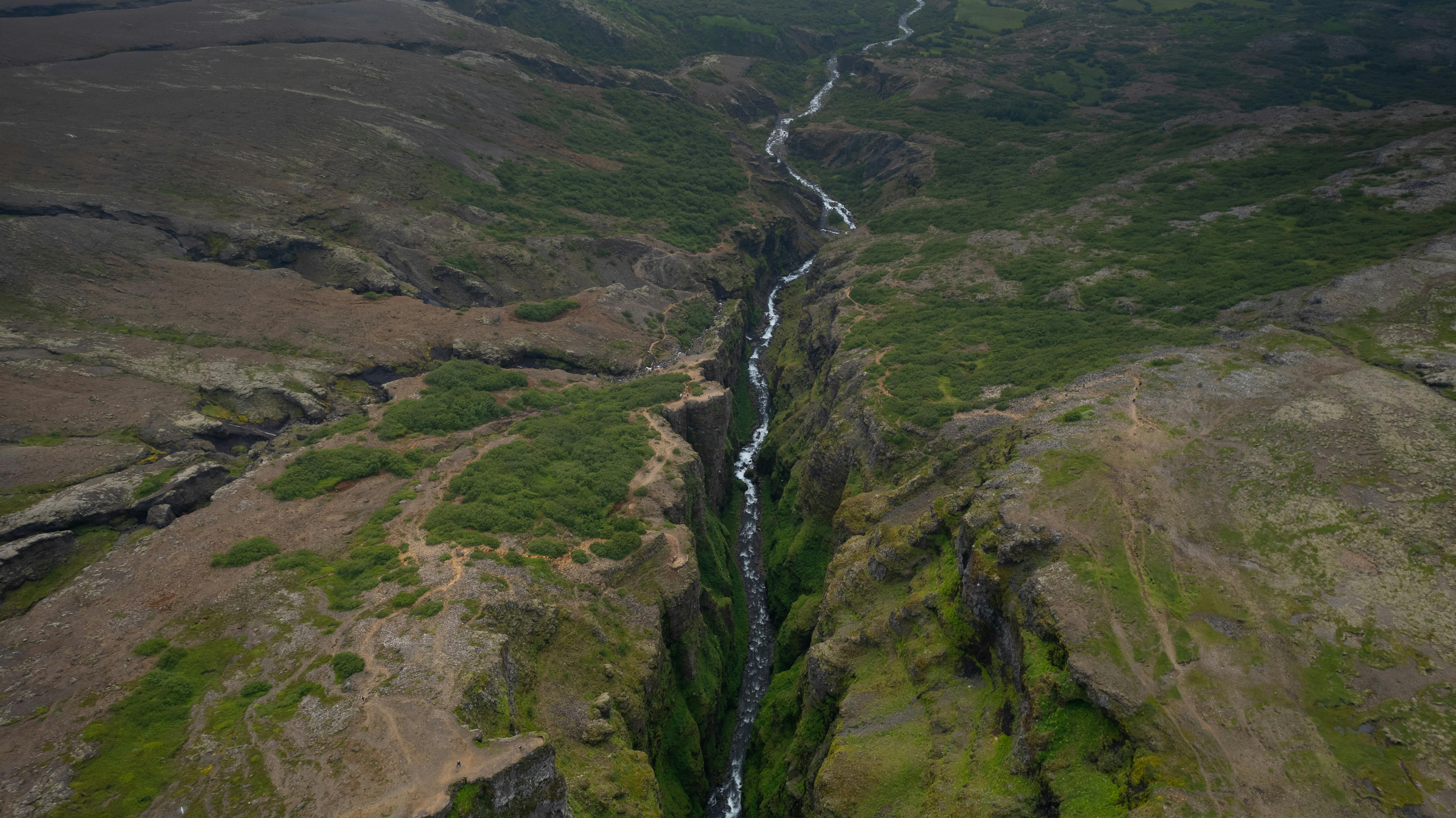 Body of Water Between Mountains · Free Stock Photo