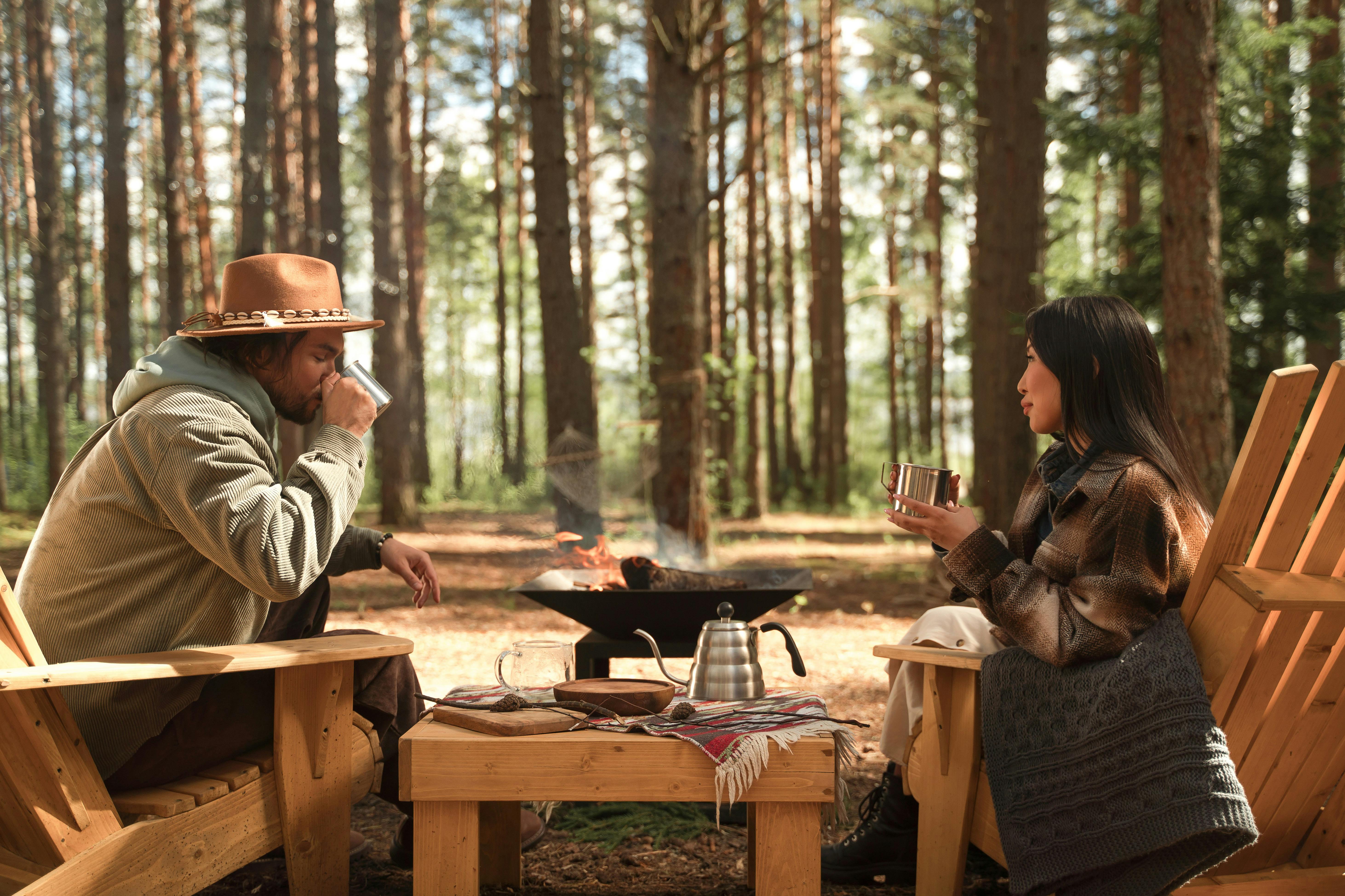 A Couple Having Coffee in a Forest · Free Stock Photo