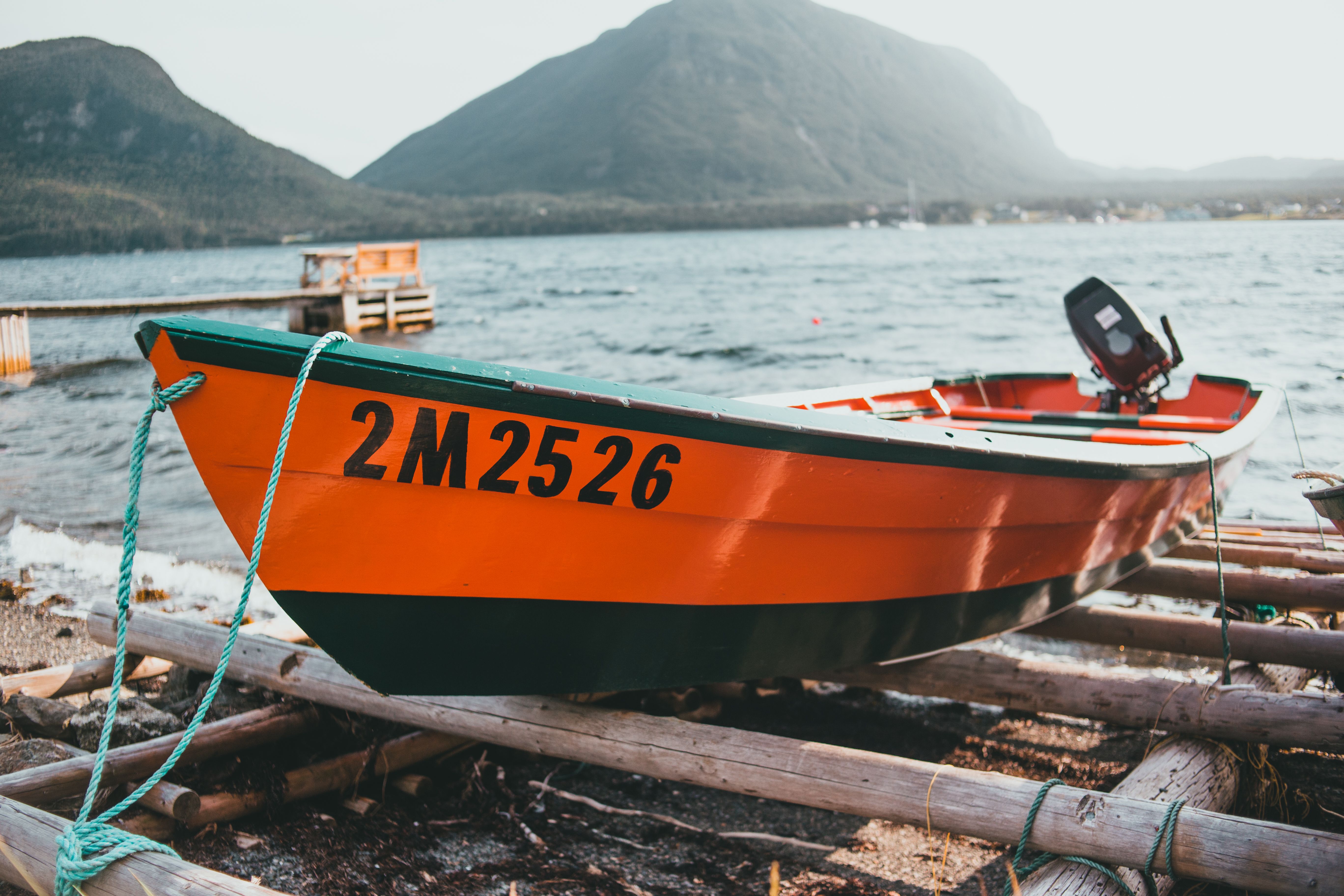 Boat on Logs on Sea Shore · Free Stock Photo