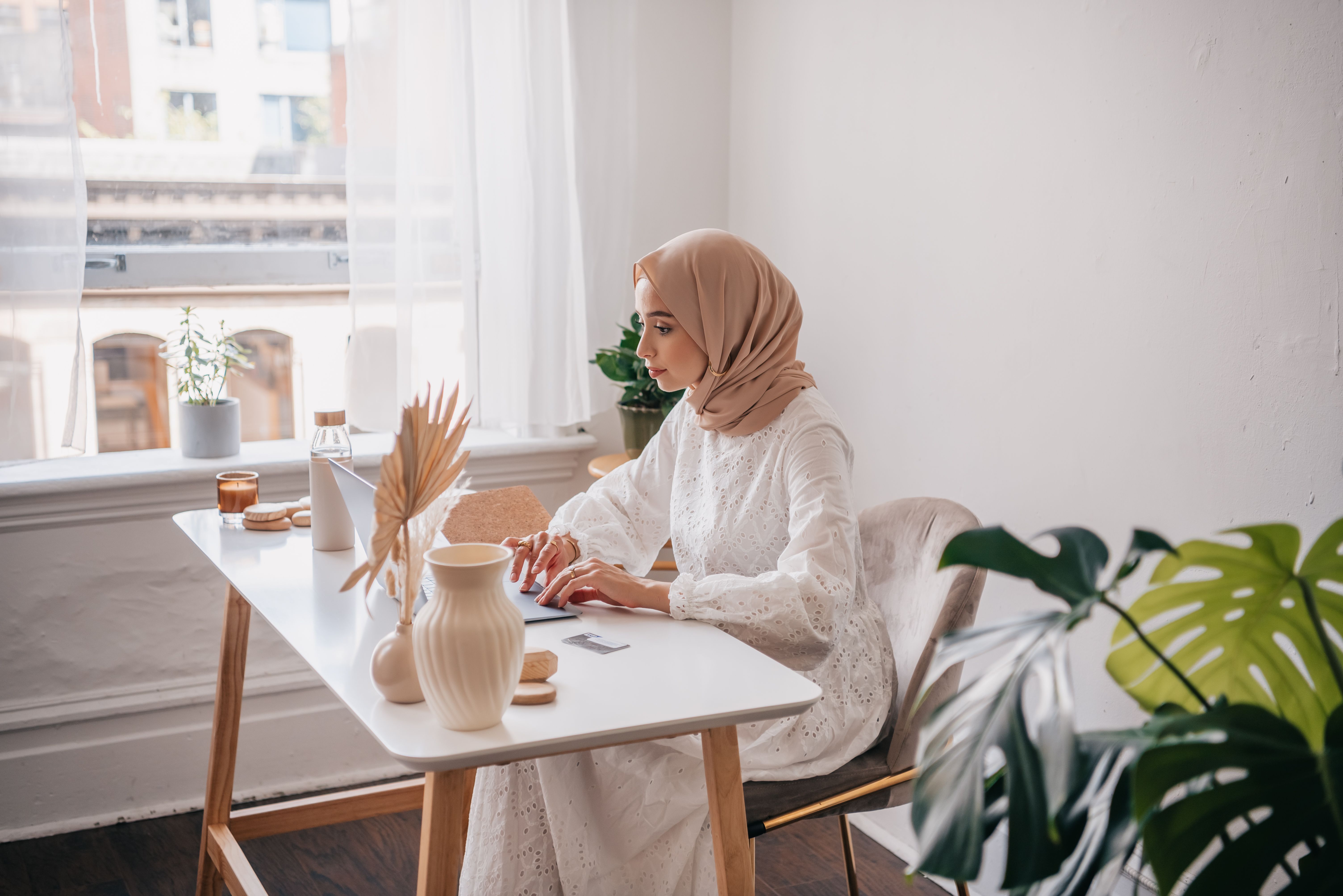 Woman Wearing Hijab Writing on a Notebook · Free Stock Photo