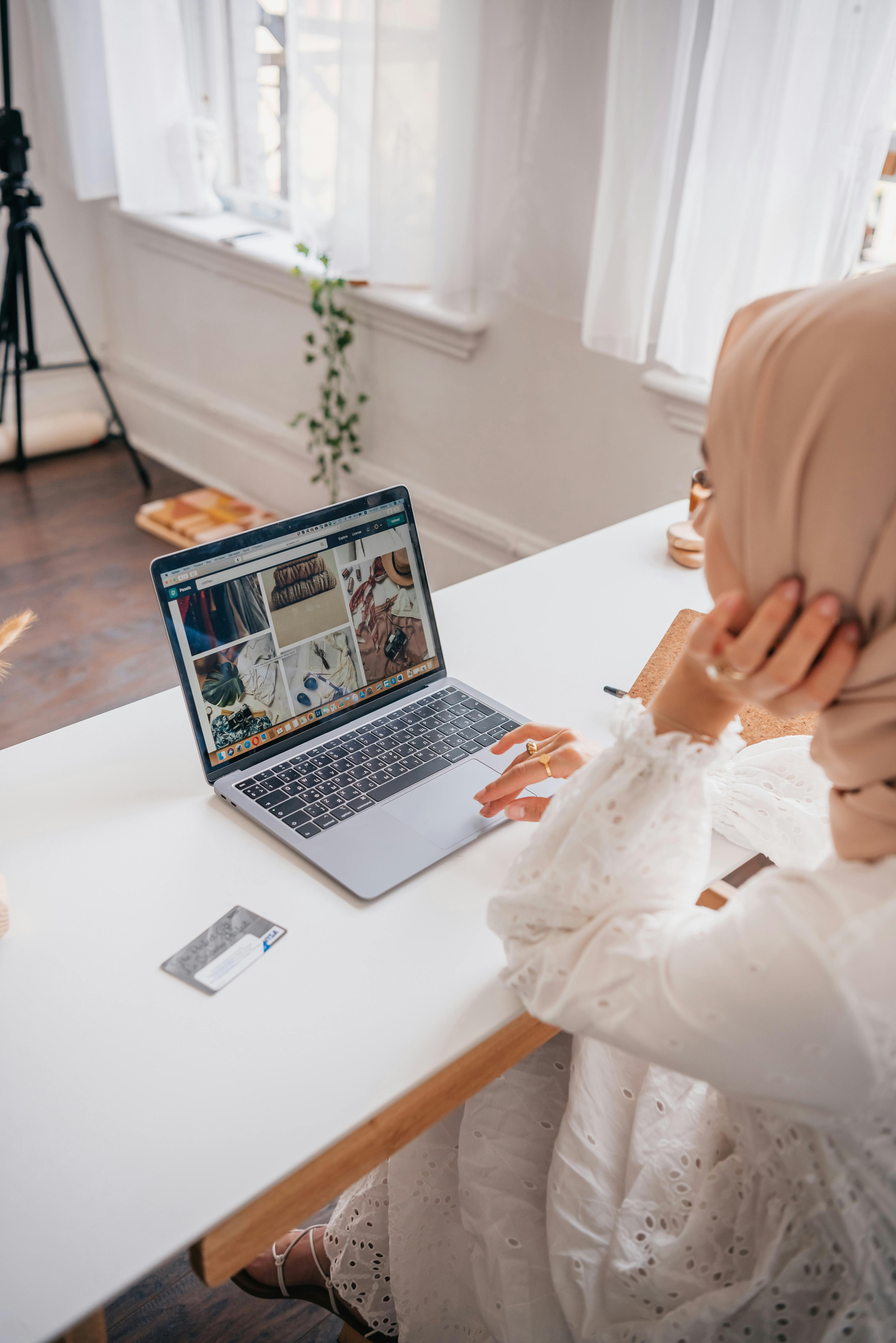 Woman Wearing Hijab Using a Laptop · Free Stock Photo