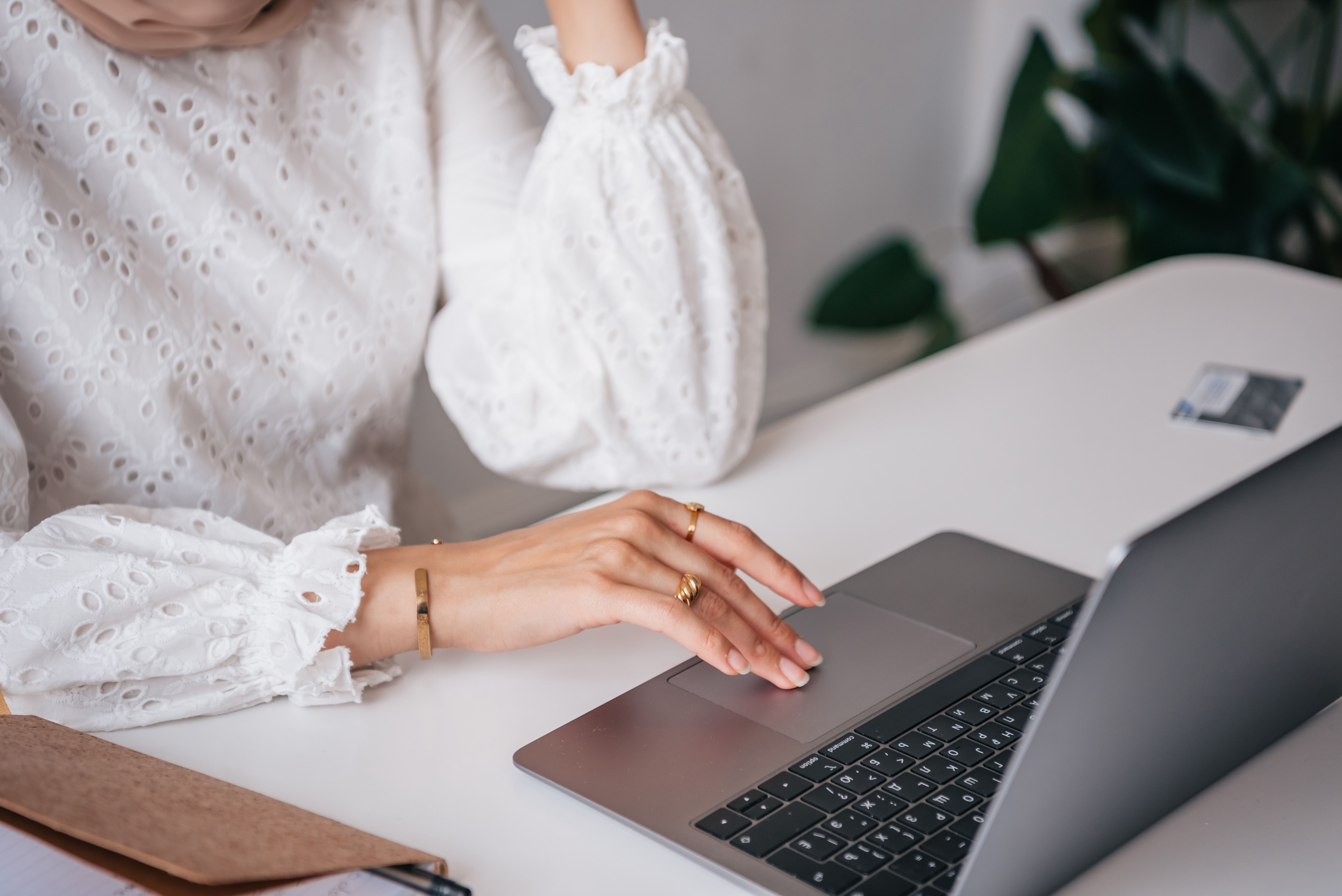 A Golden Balance Scale beside a Laptop · Free Stock Photo