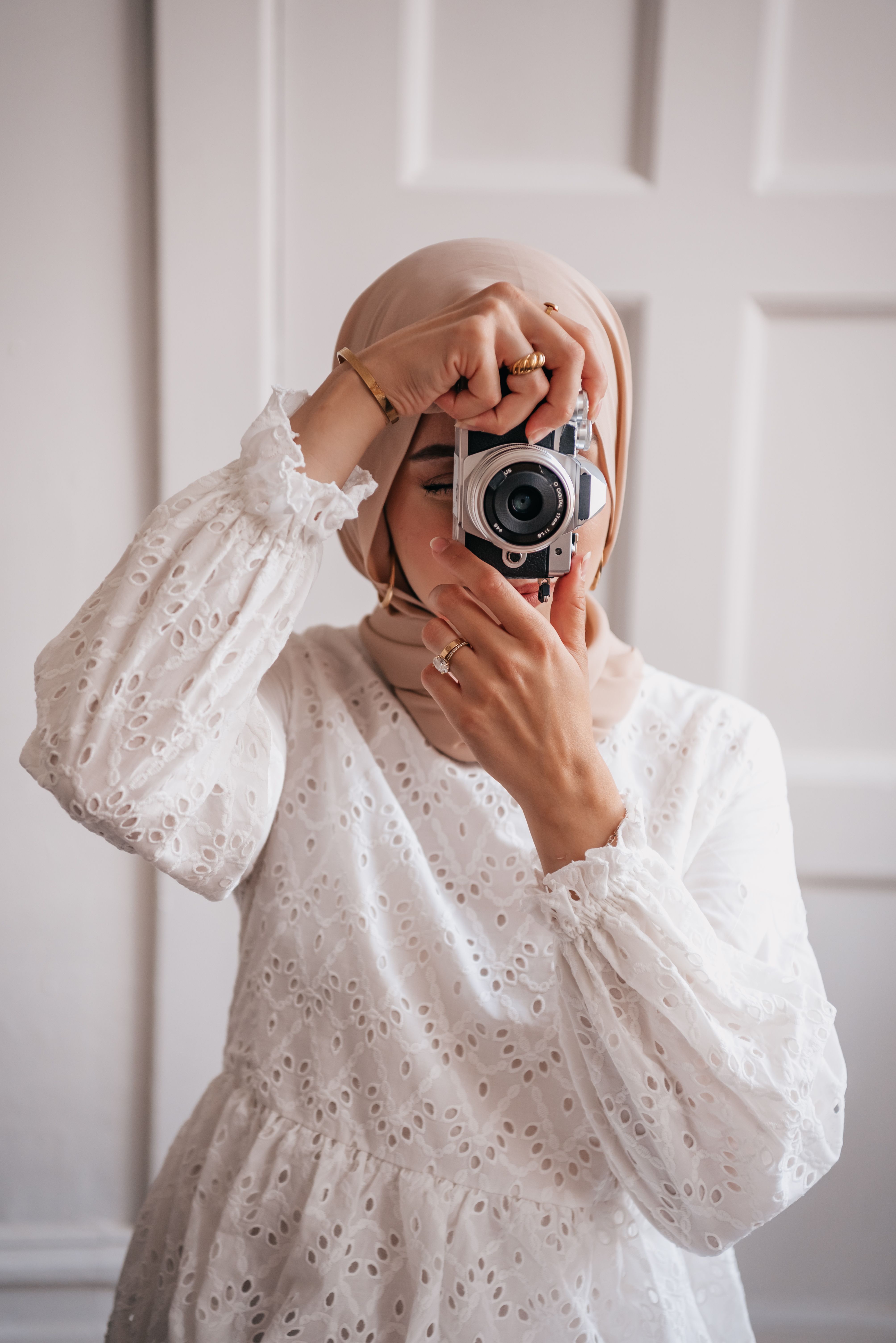 Woman Wearing Hijab Taking Photo with a Camera · Free Stock Photo