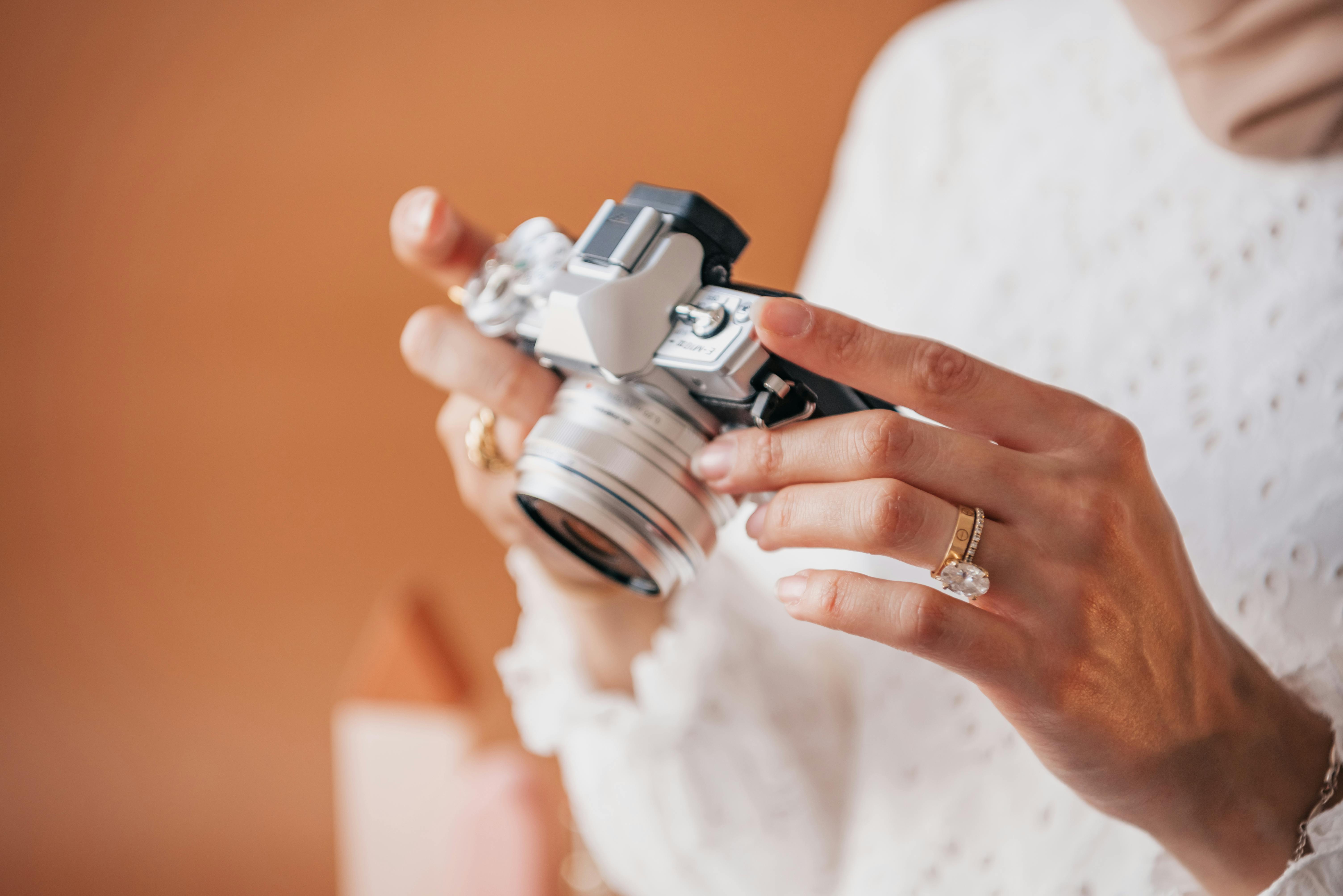 Person Holding Silver and Black Camera · Free Stock Photo