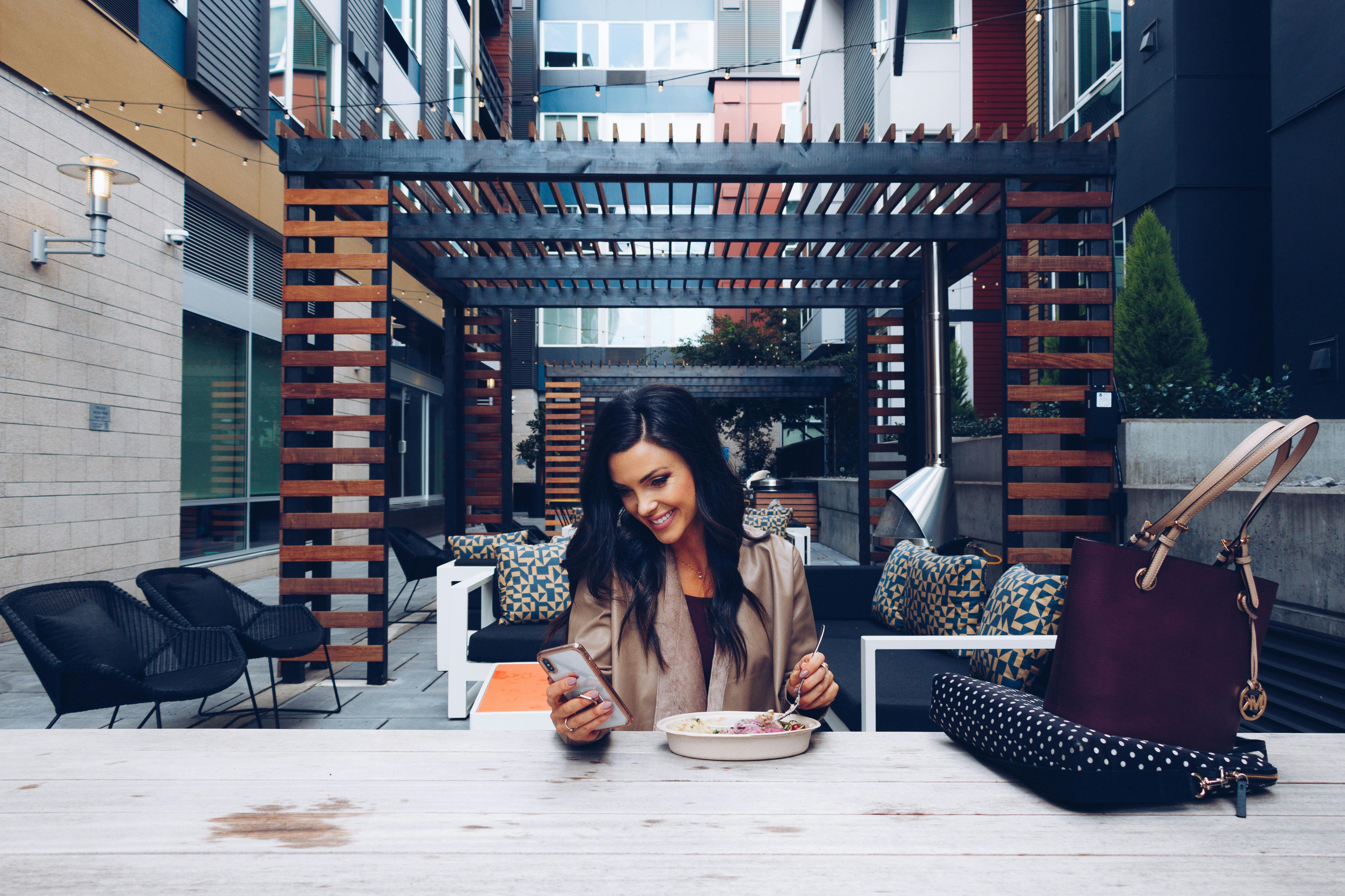 Elegant Brunette Woman Eating Lunch in Restaurant · Free Stock Photo