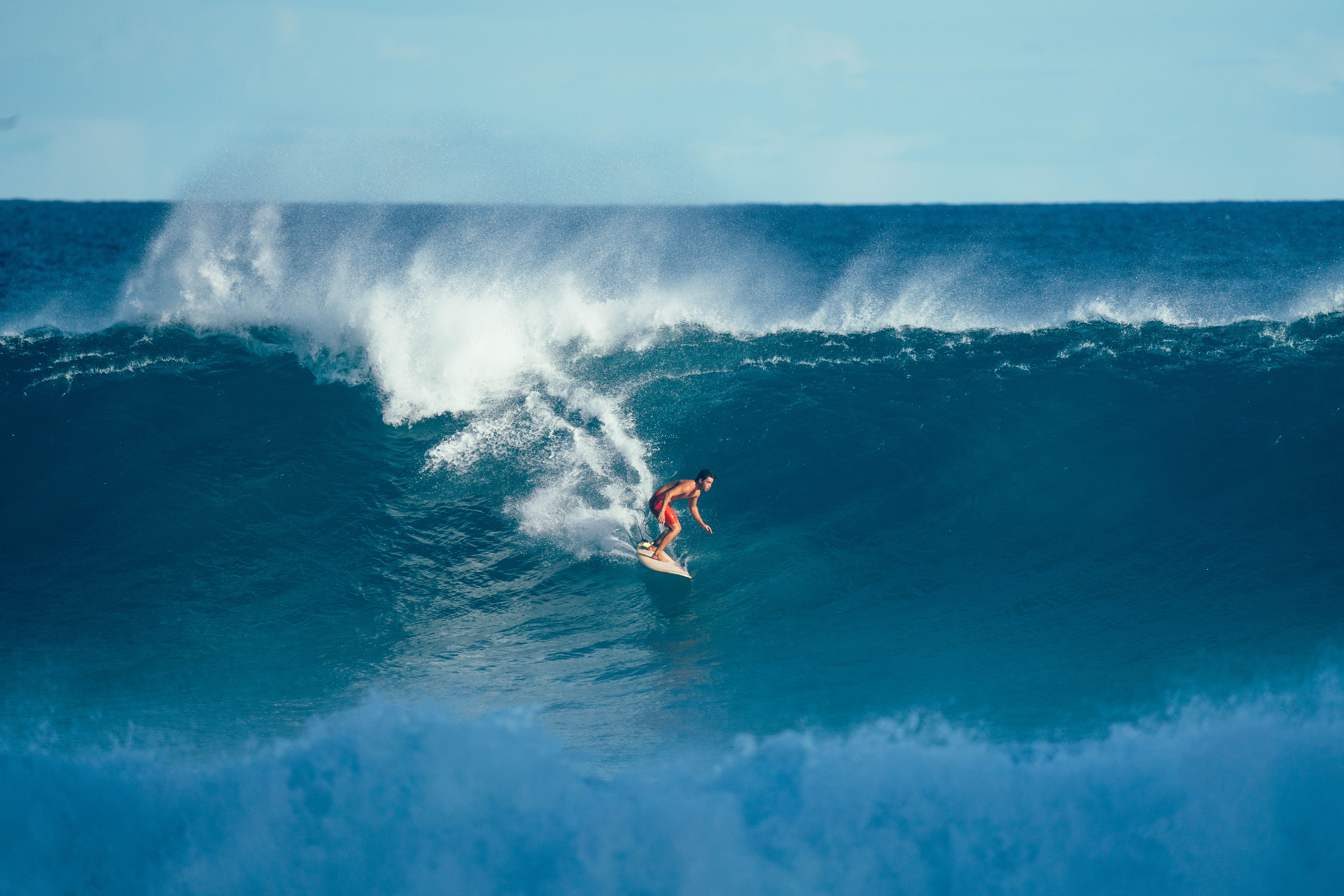 Photo of People Surfing on Waves · Free Stock Photo