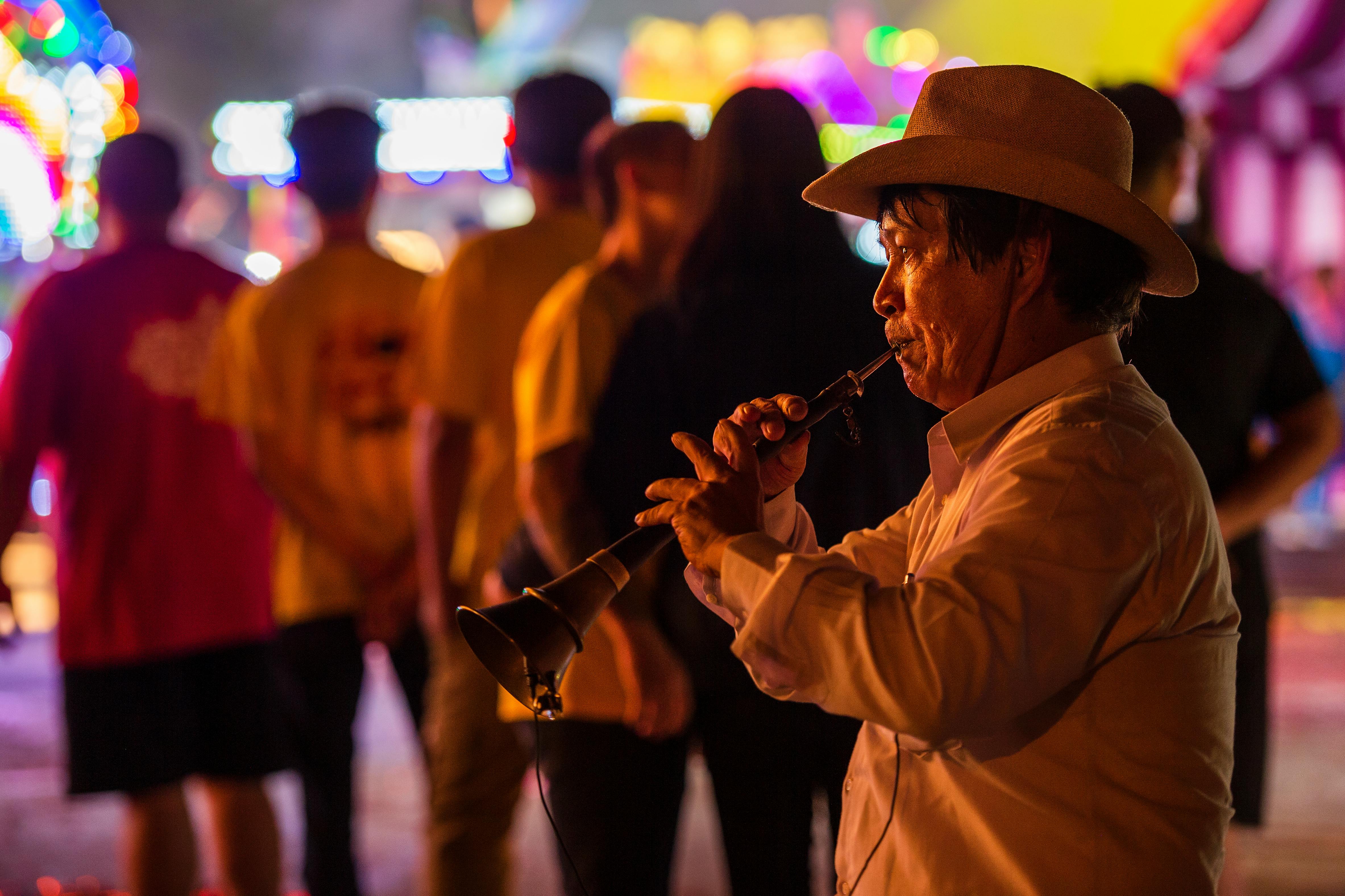 Close-Up Photo of Man Playing Wind Instrument · Free Stock Photo