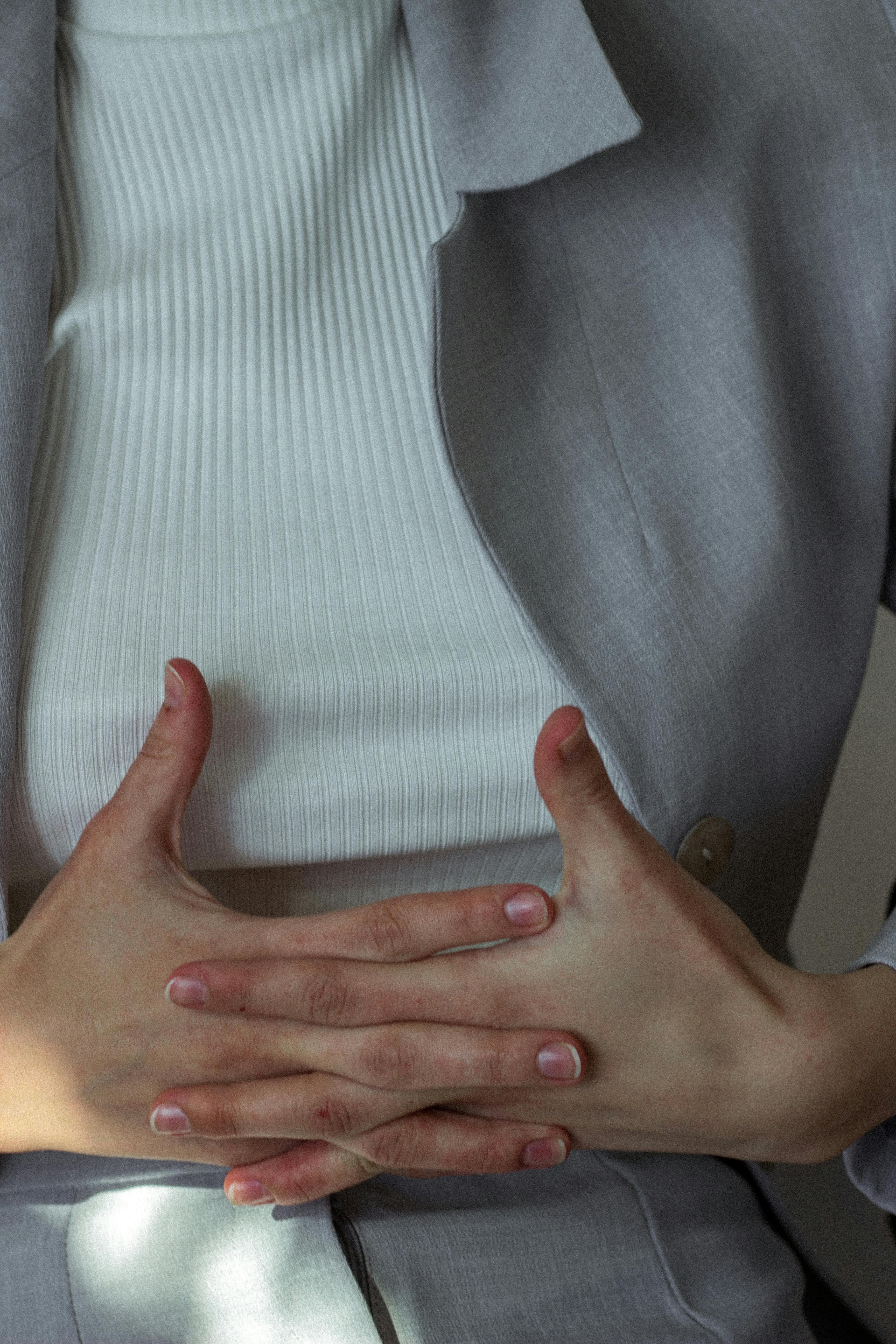 Person Wearing Gray Blazer with Hands Together · Free Stock Photo