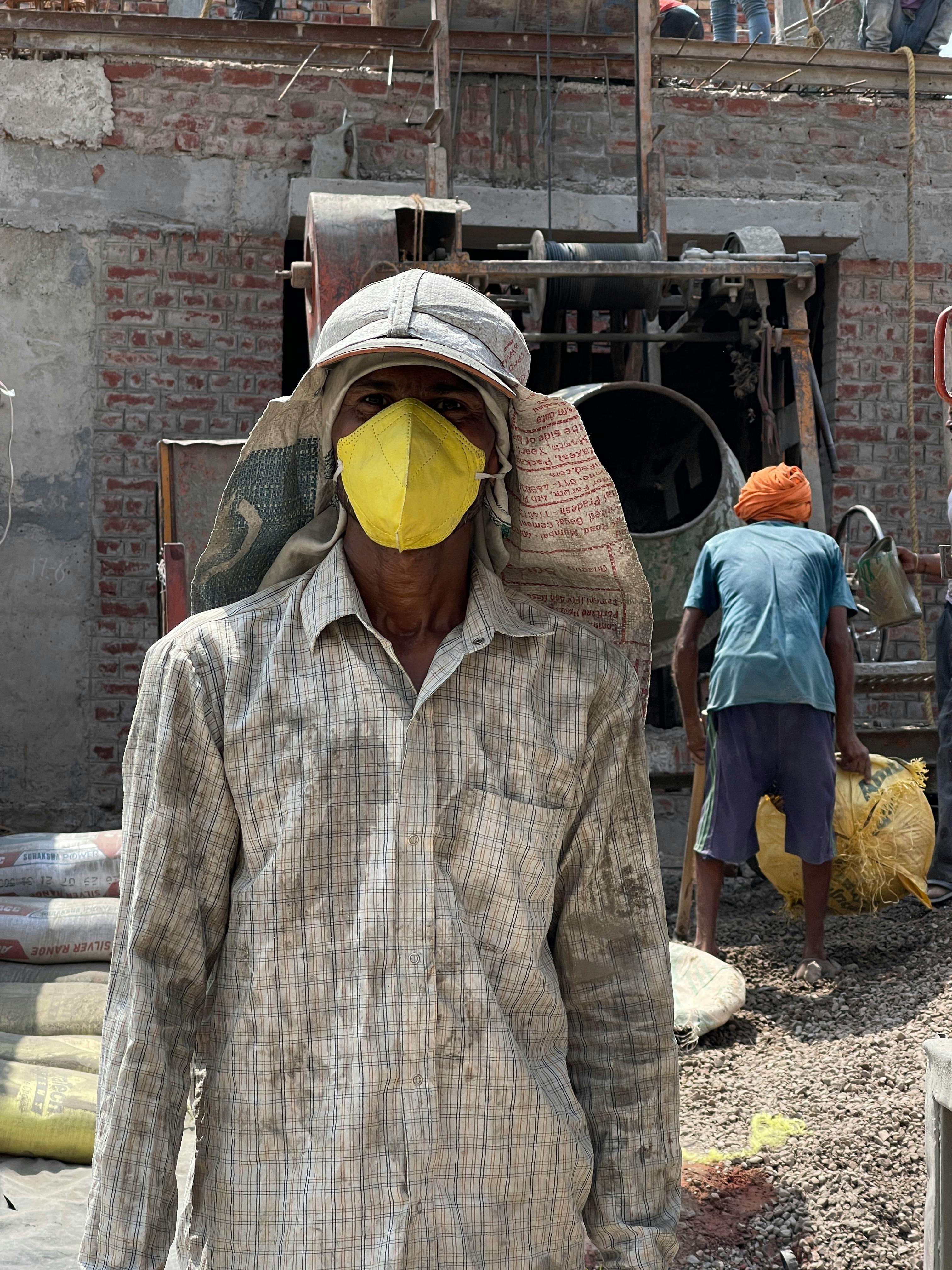 Laborer Wearing Yellow Face Mask · Free Stock Photo