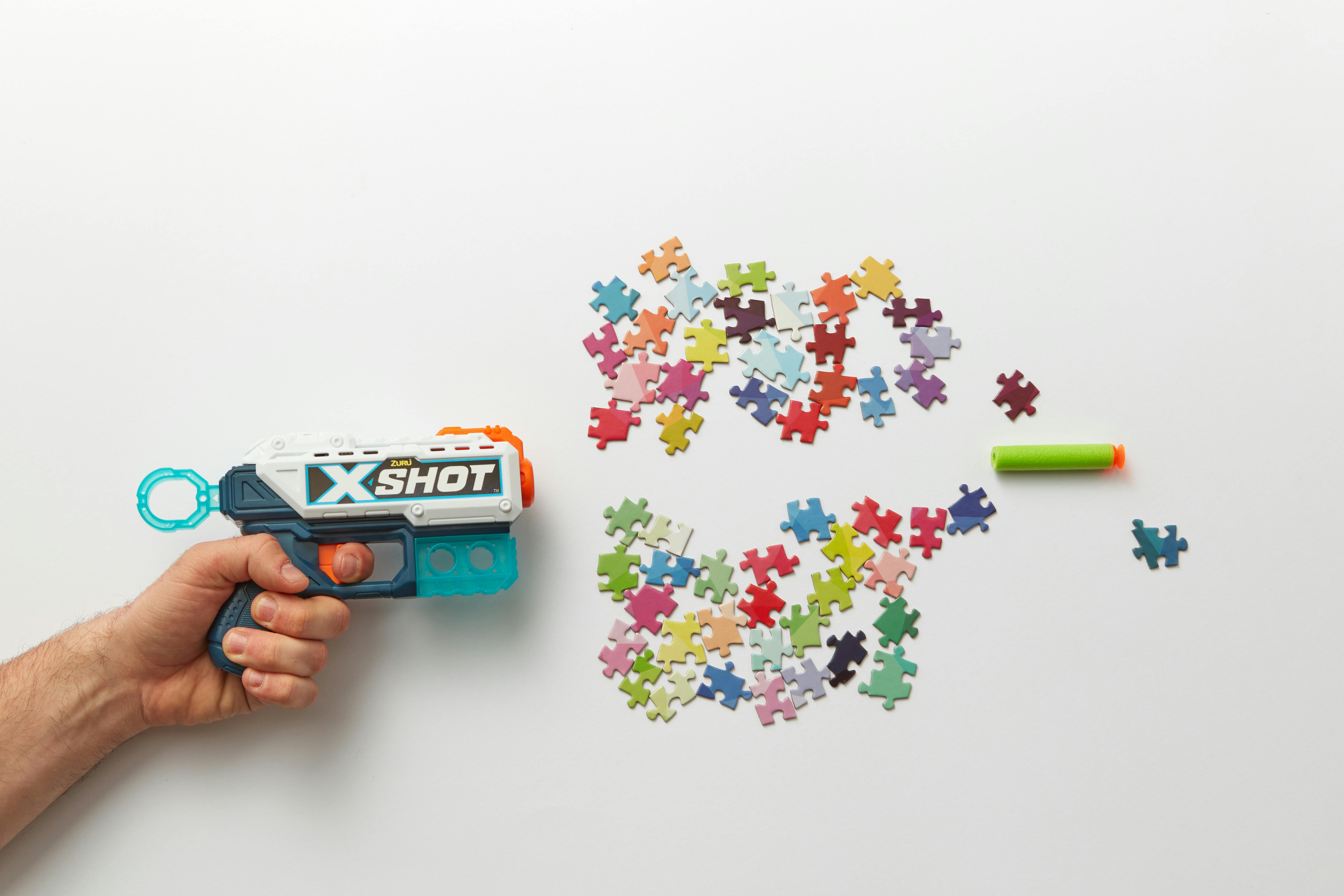 Toy Pistol and Puzzles · Free Stock Photo