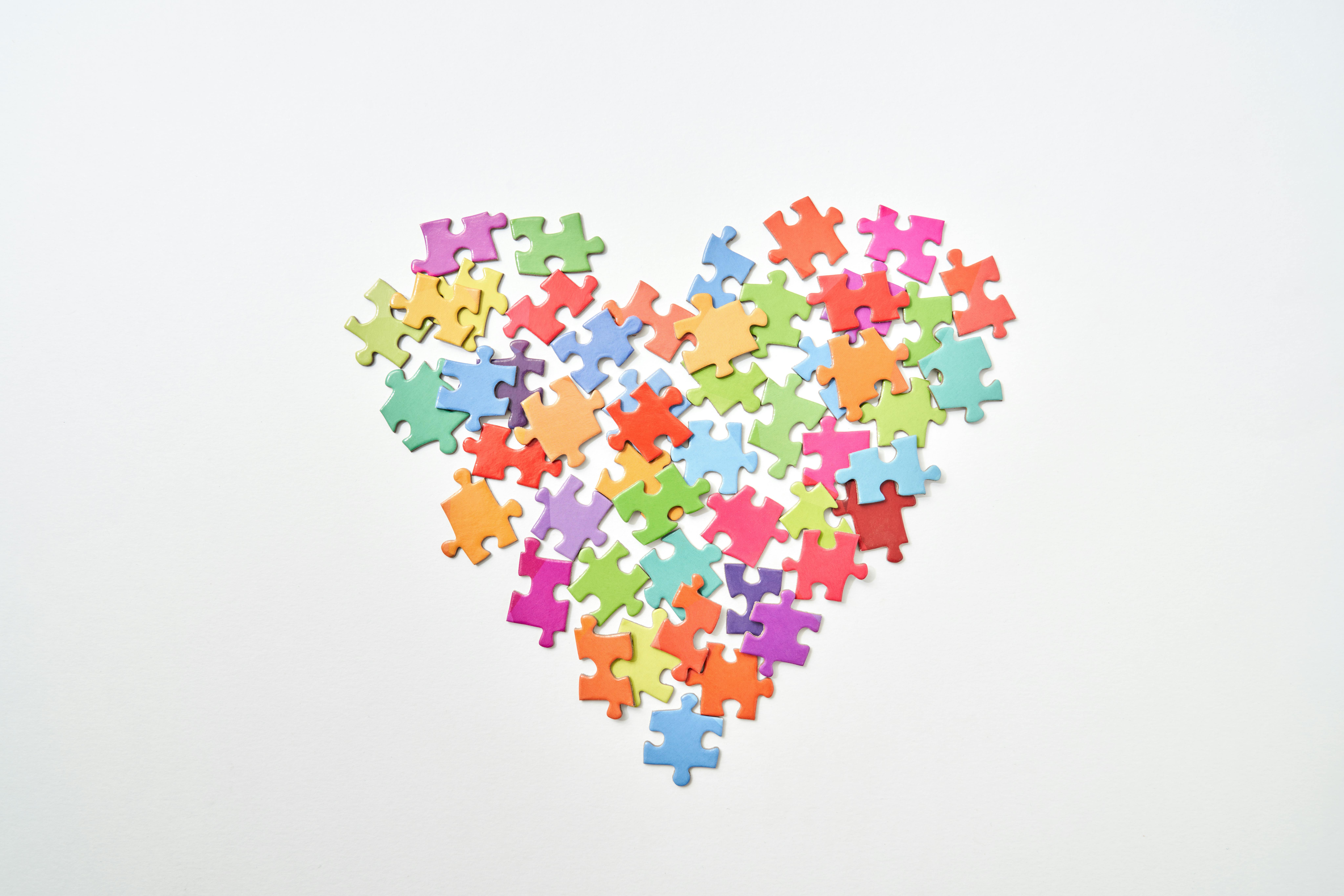 Heart Shaped Puzzle Pieces on White Background · Free Stock Photo