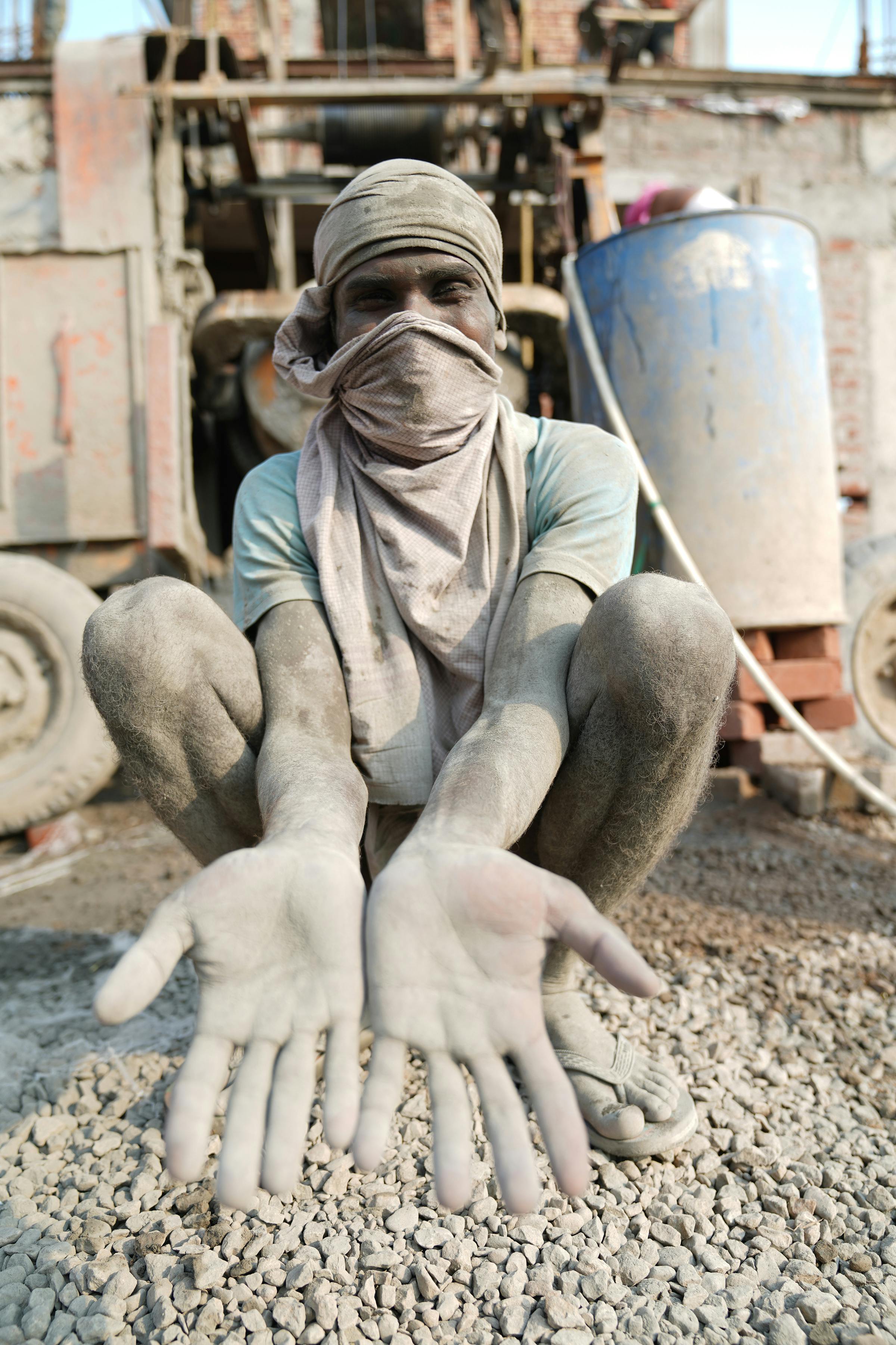 Man Sweeping Streets Throwing away Dust in Bin · Free Stock Photo