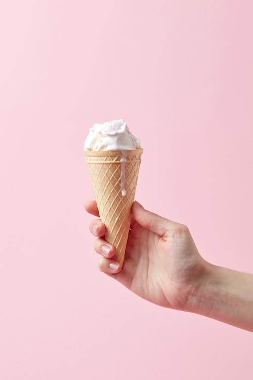 Person Holding Ice Cream Cone · Free Stock Photo Person Holding Ice Cream Cone · Free Stock Photo