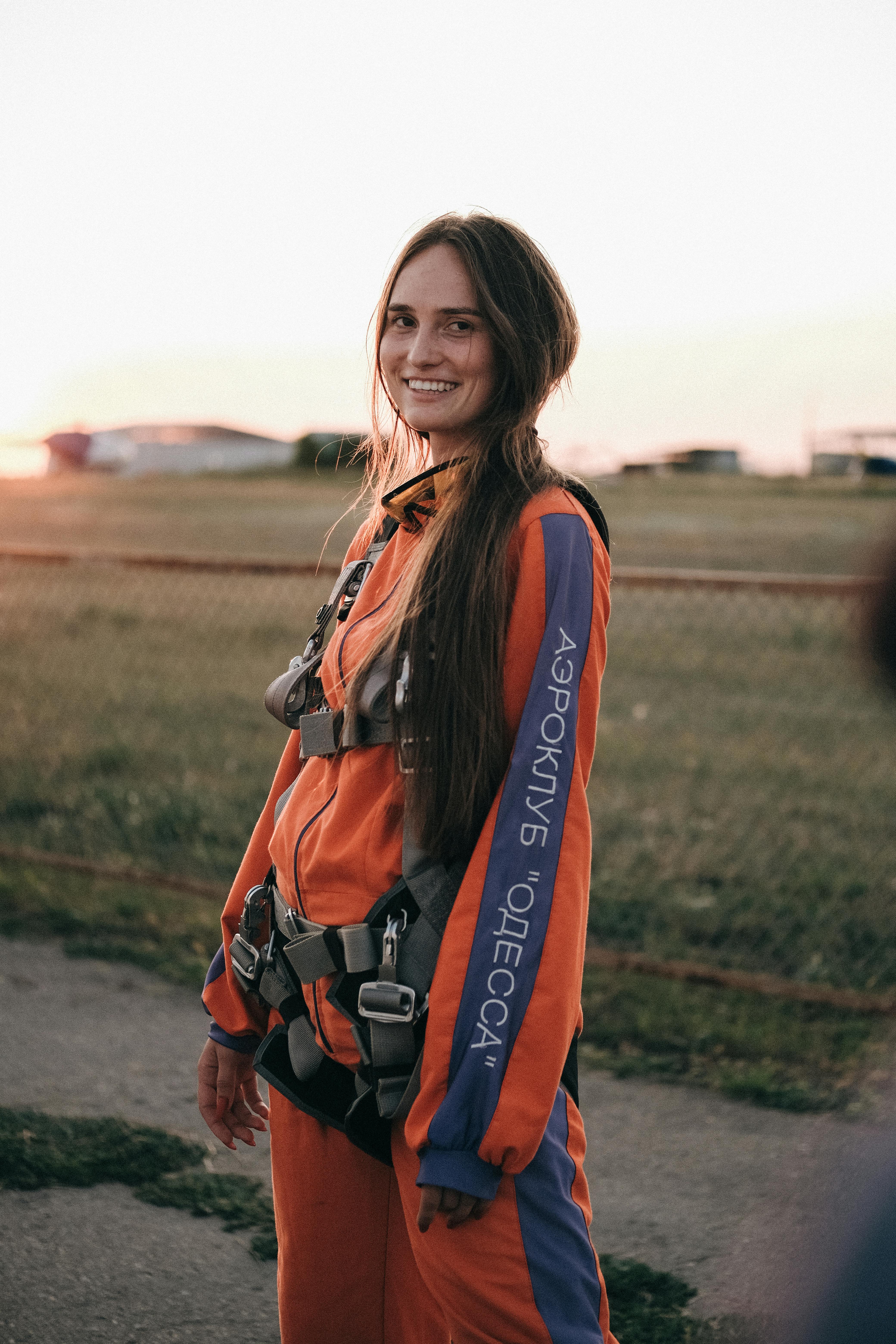 Smiling Woman in Parachuting Jumpsuit · Free Stock Photo