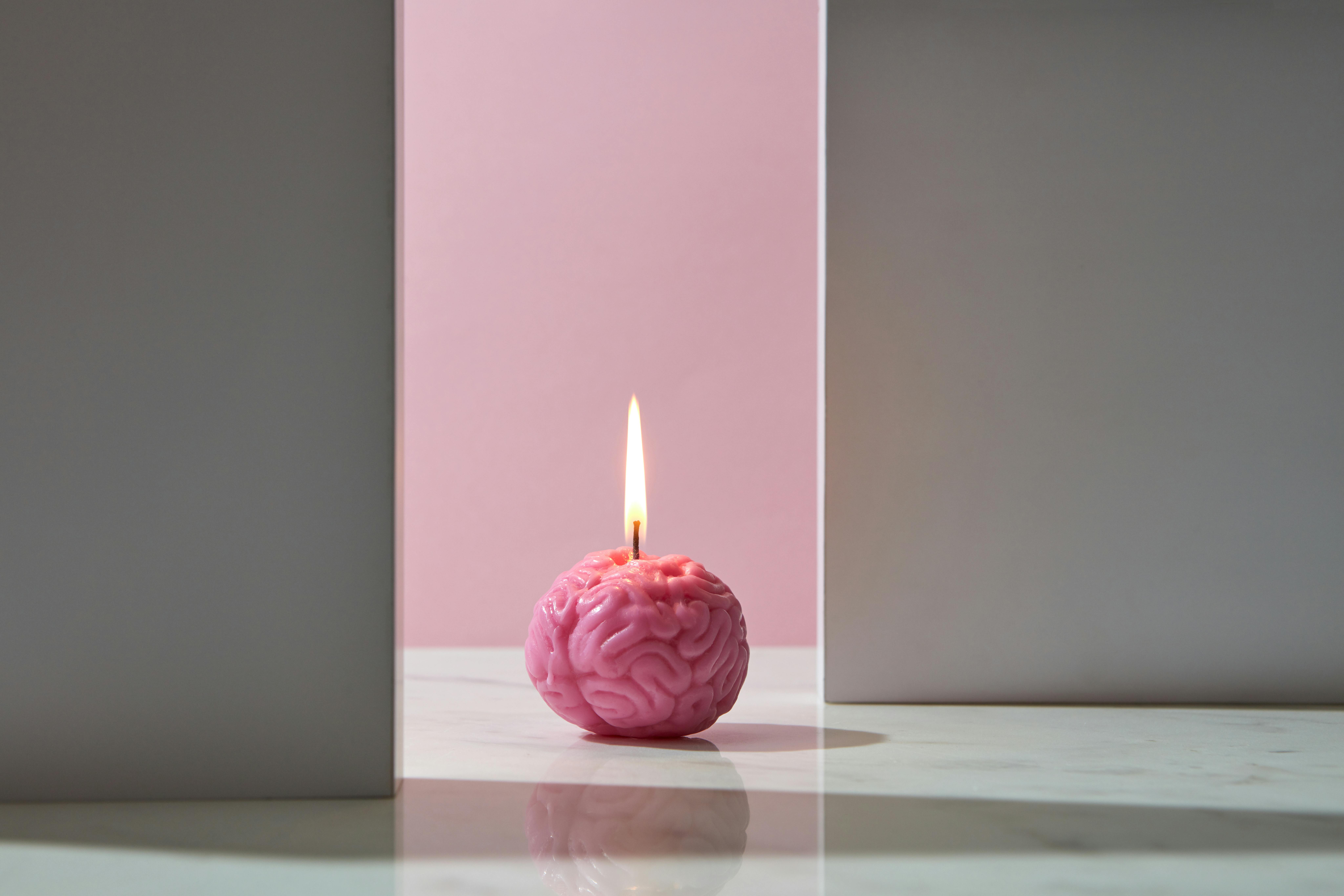 Photograph of a Lit Brain Candle · Free Stock Photo