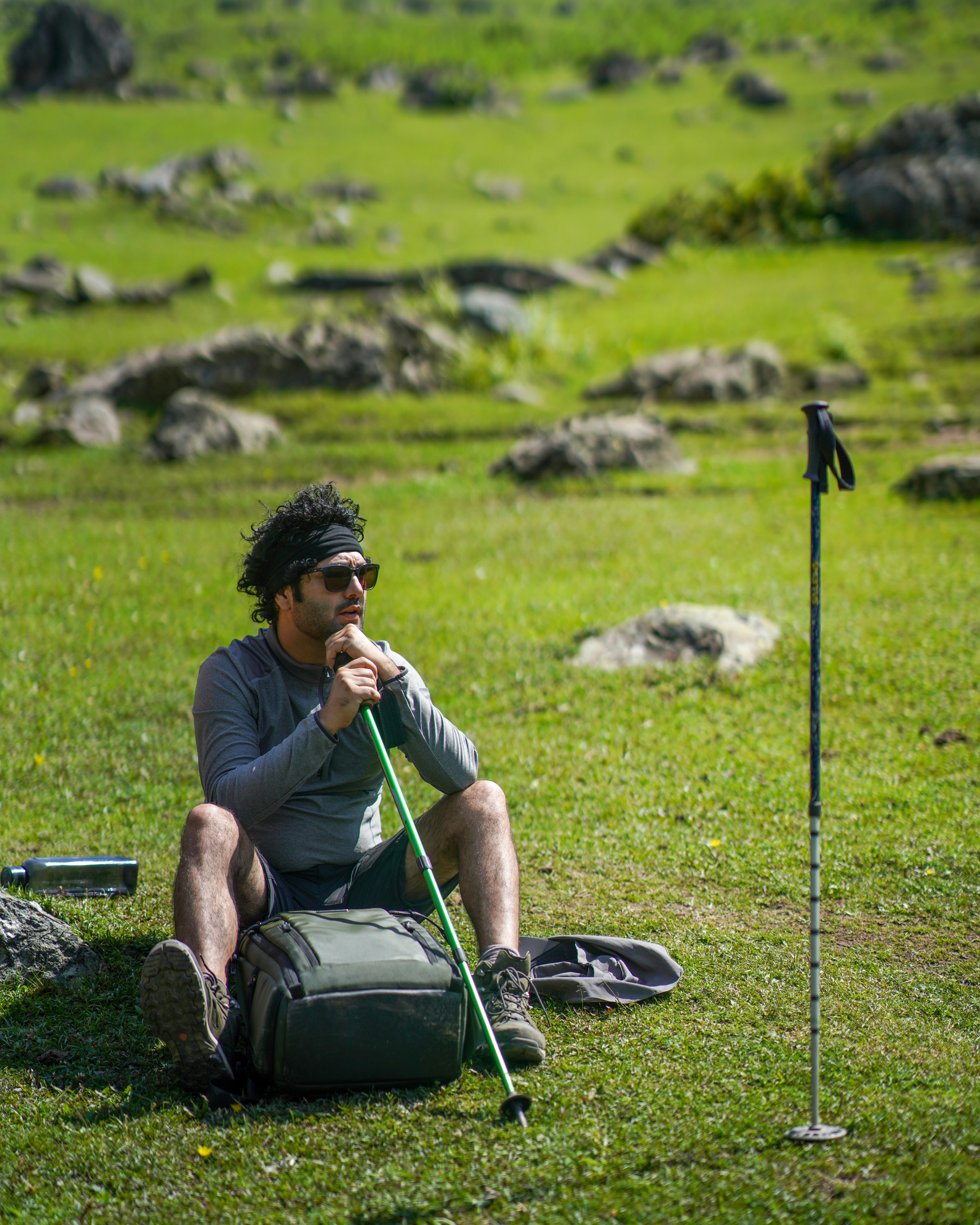 Photo of a Hiker Sitting on His Backpack · Free Stock Photo