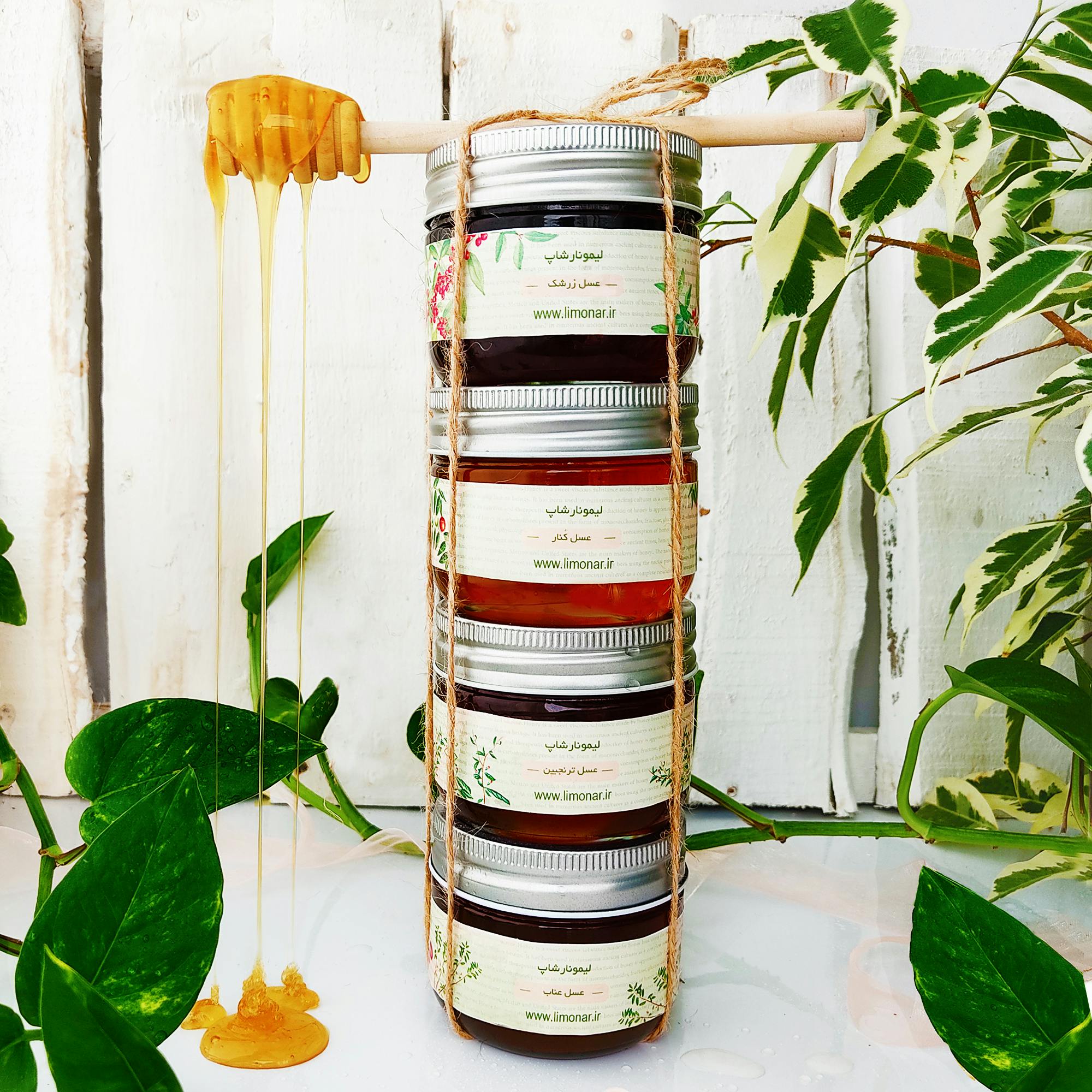 A Teaspoonful of Honey over the Bottle · Free Stock Photo