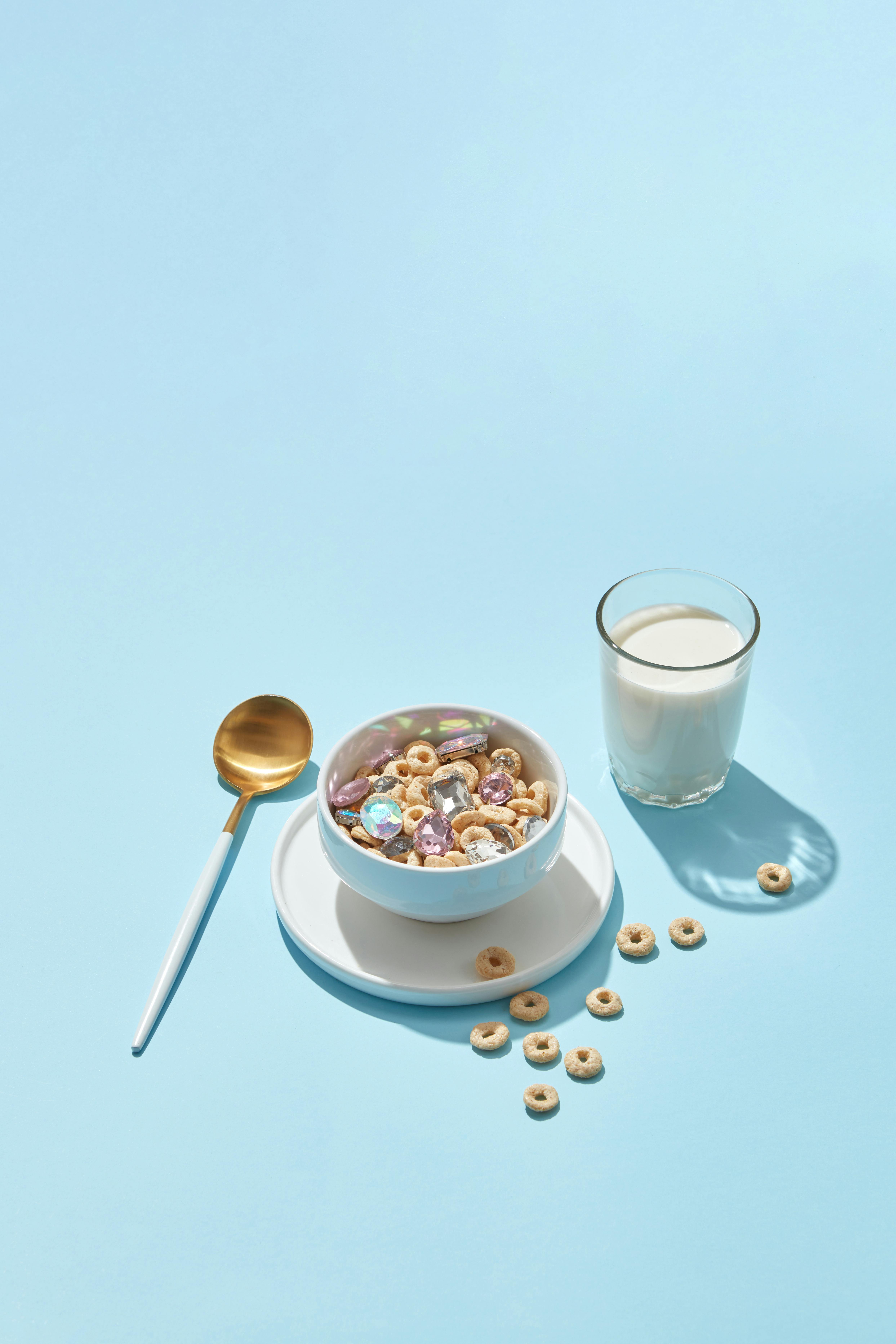 Photo of a Bowl with Cereals and Diamonds Beside a Glass of Milk · Free ...