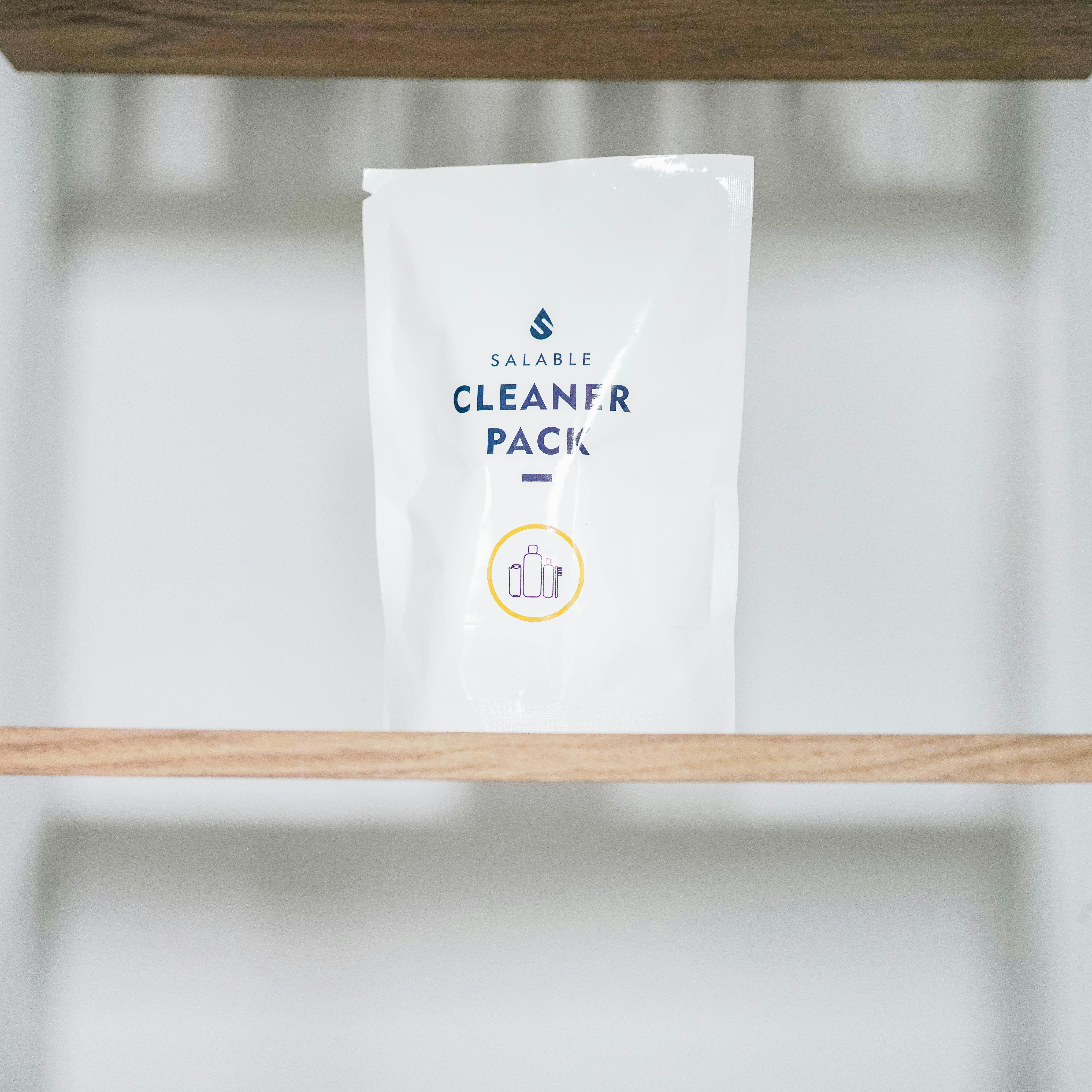A Cleaner Pack on a Wooden Shelf · Free Stock Photo