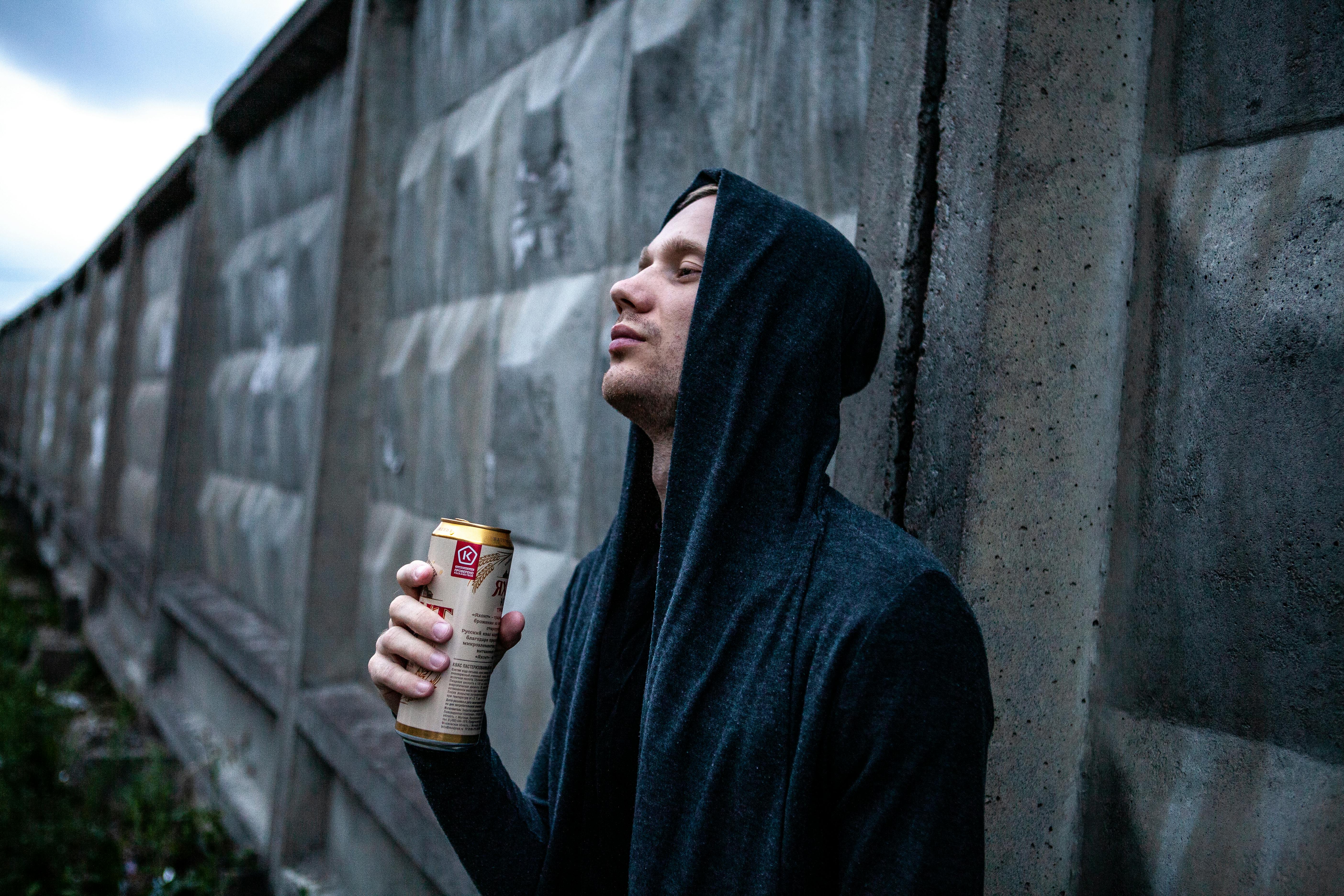 A Man Holding a Can of Beer · Free Stock Photo