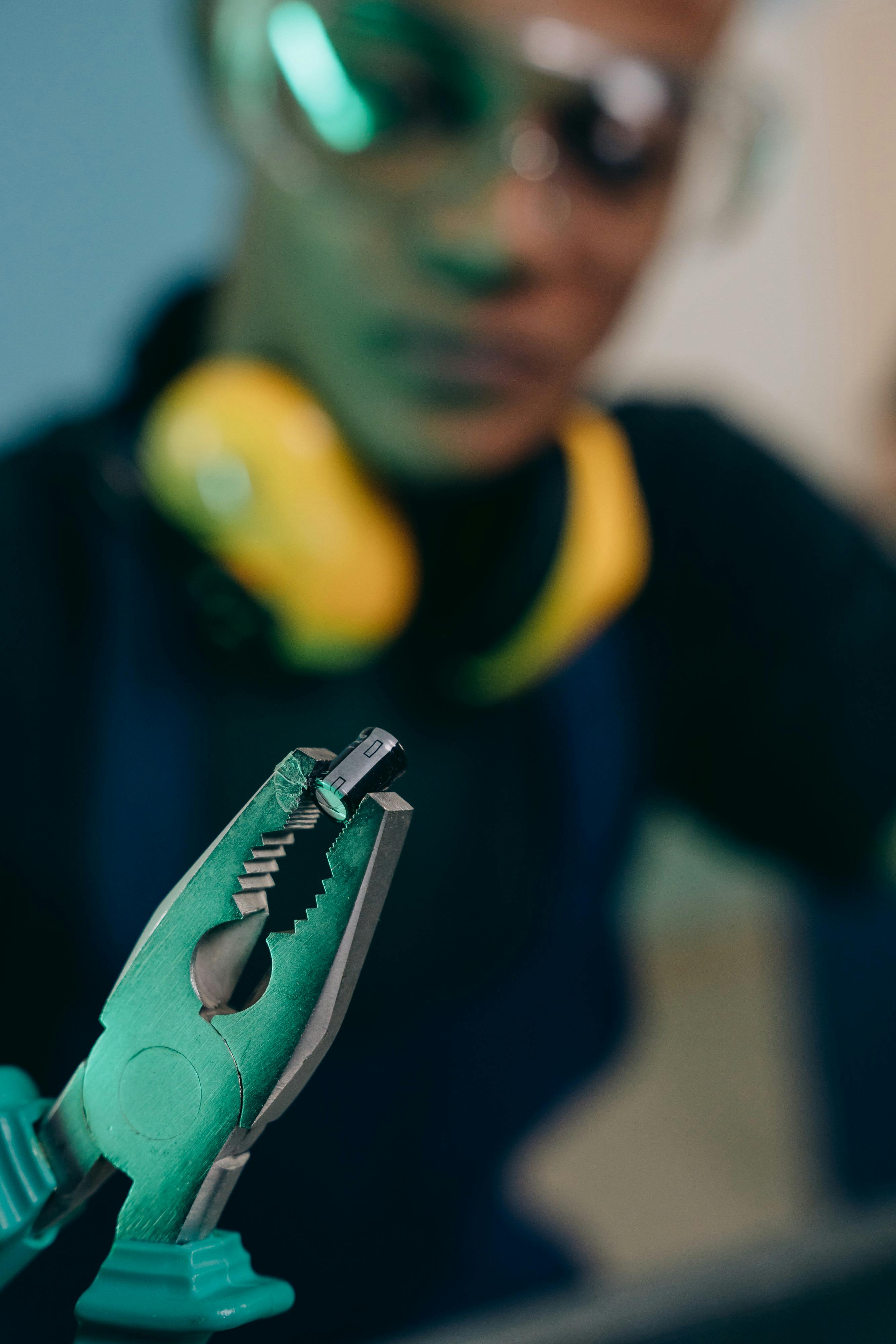 Man Using Bench Grinder · Free Stock Photo