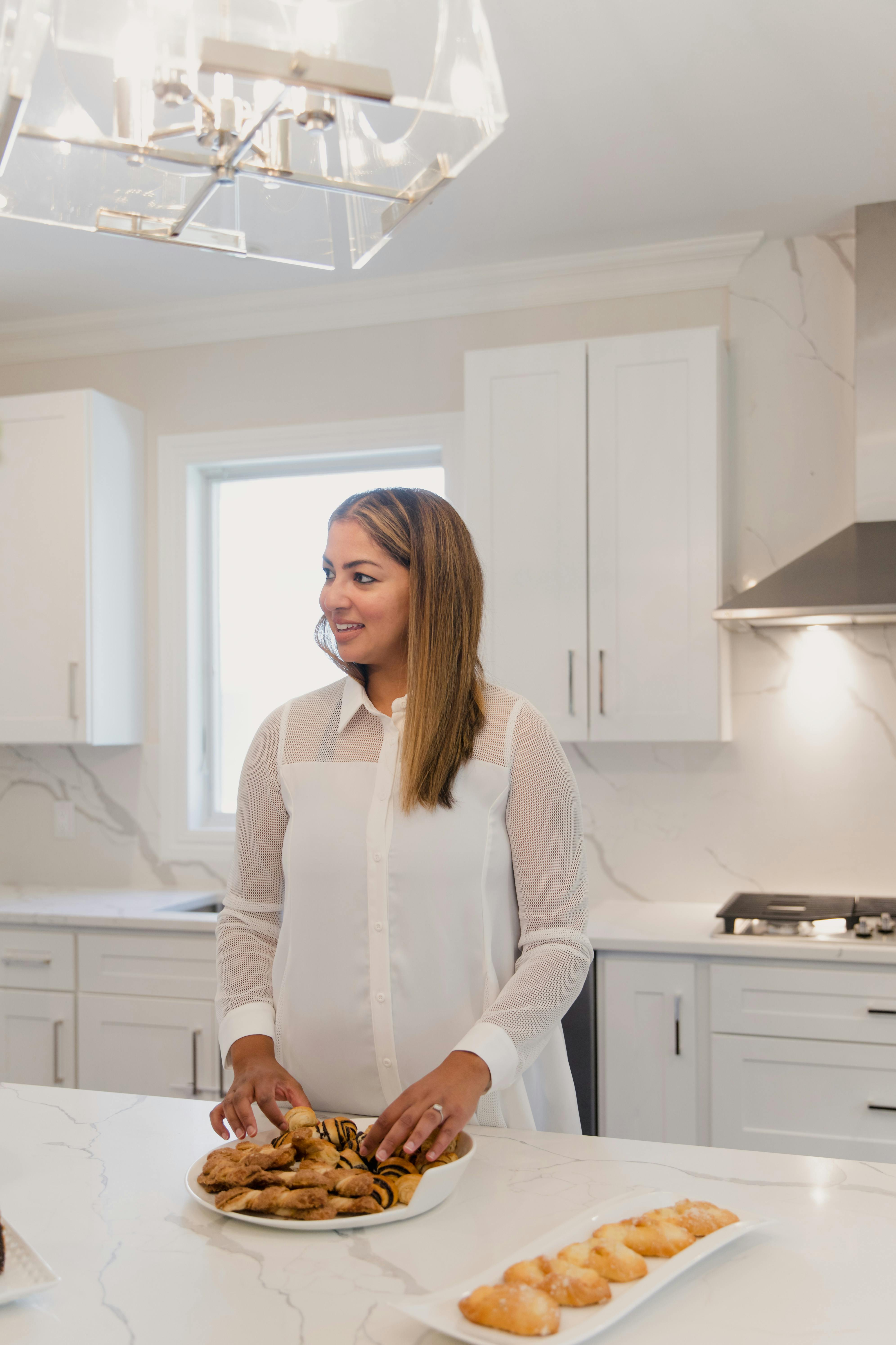 Woman Standing on Beside Kitchen Counter · Free Stock Photo