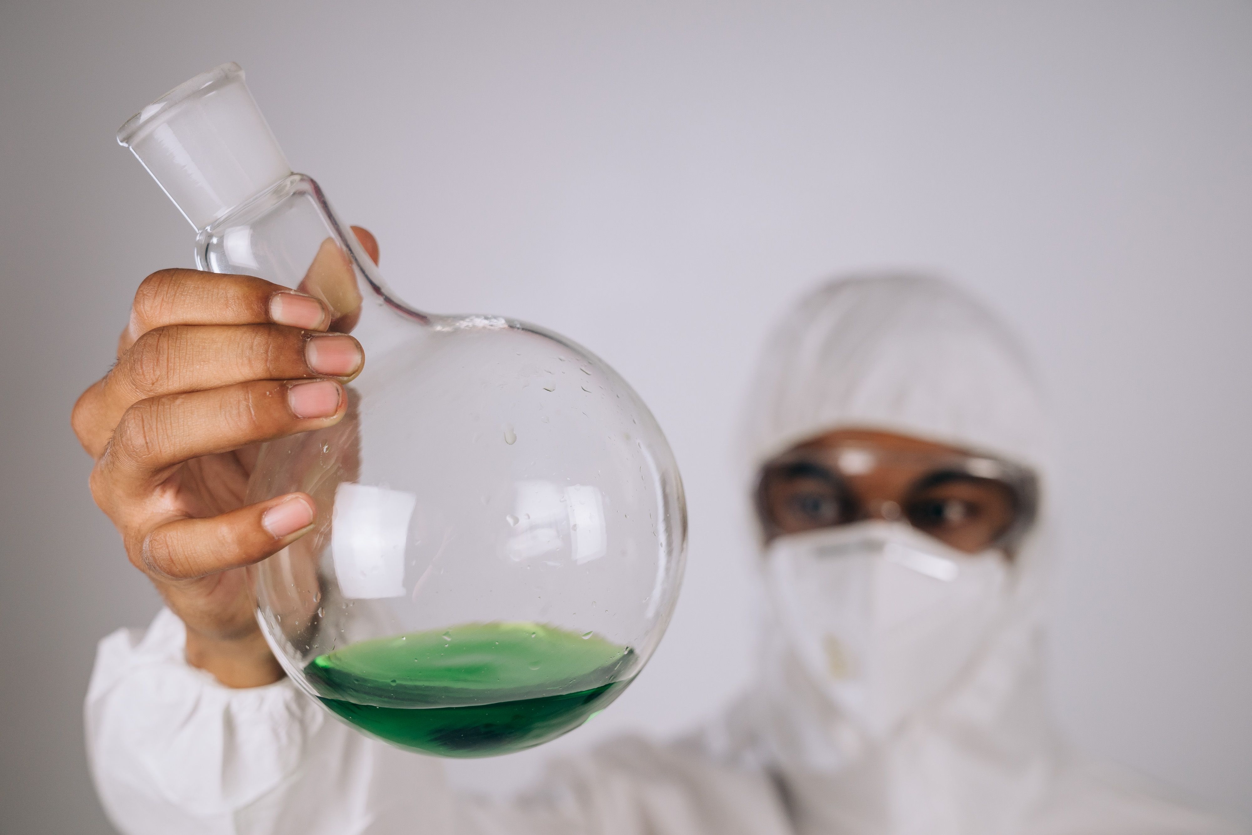 A Person Holding a Flask · Free Stock Photo
